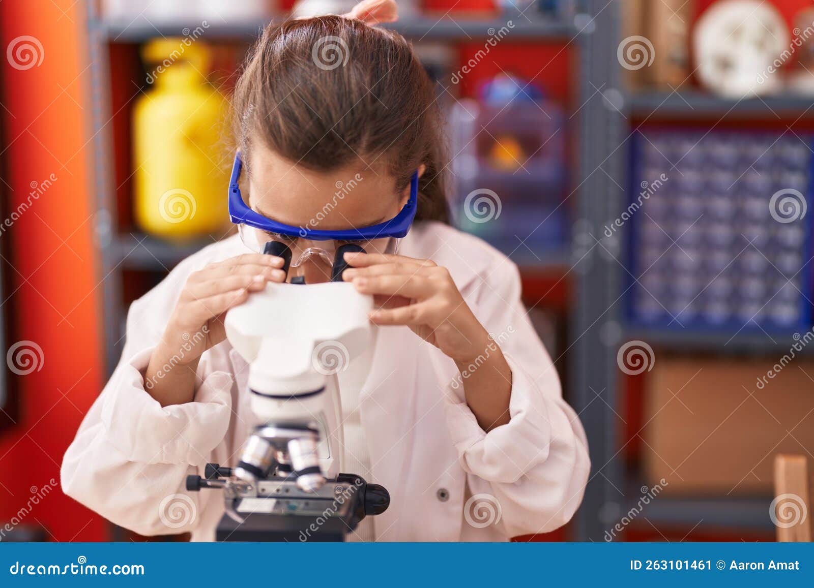 Adorable Hispanic Girl Student Using Microscope at Classroom Stock ...