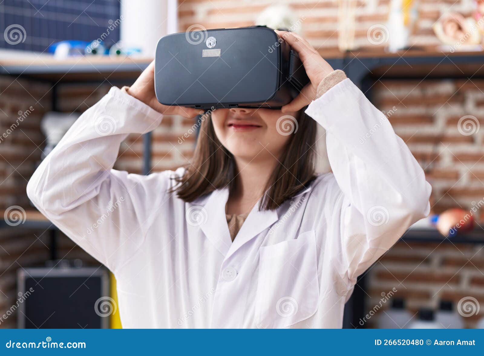 Adorable Hispanic Girl Student Using Virtual Reality Glasses at ...