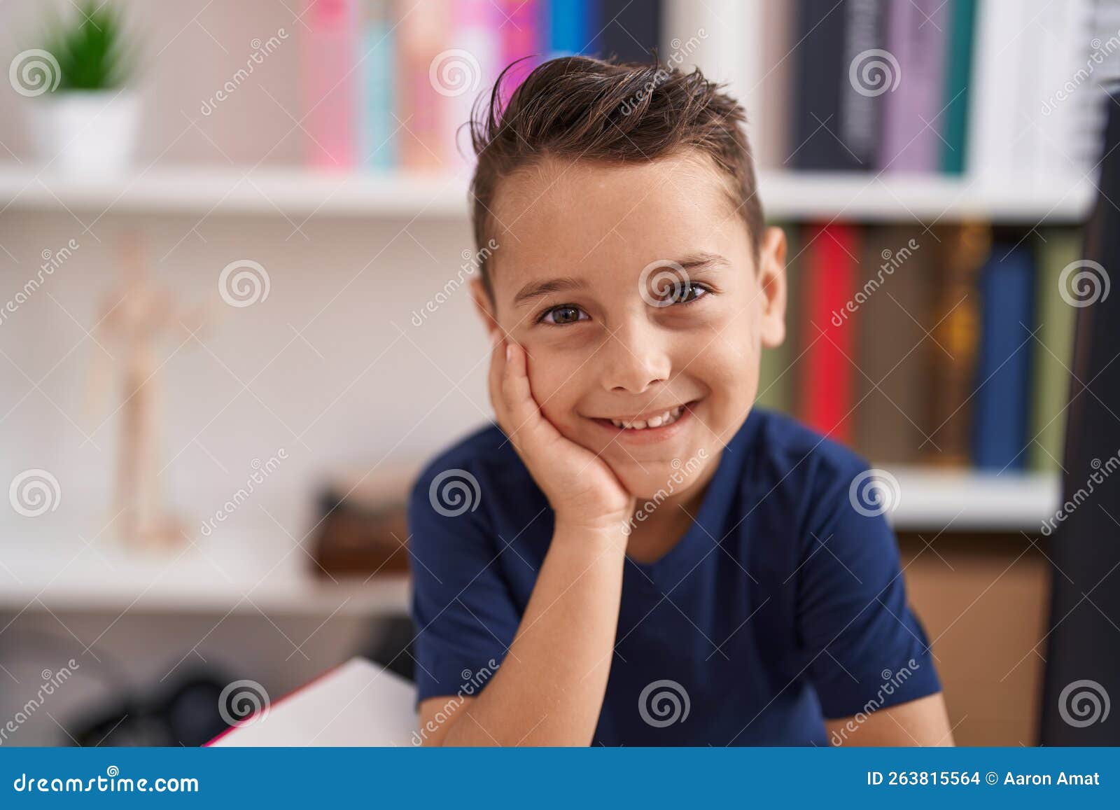 Adorable Hispanic Toddler Smiling Confident Sitting on Table at Library ...