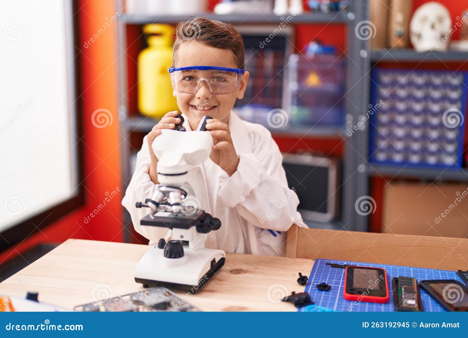 Adorable Hispanic Toddler Student Using Microscope Standing at ...