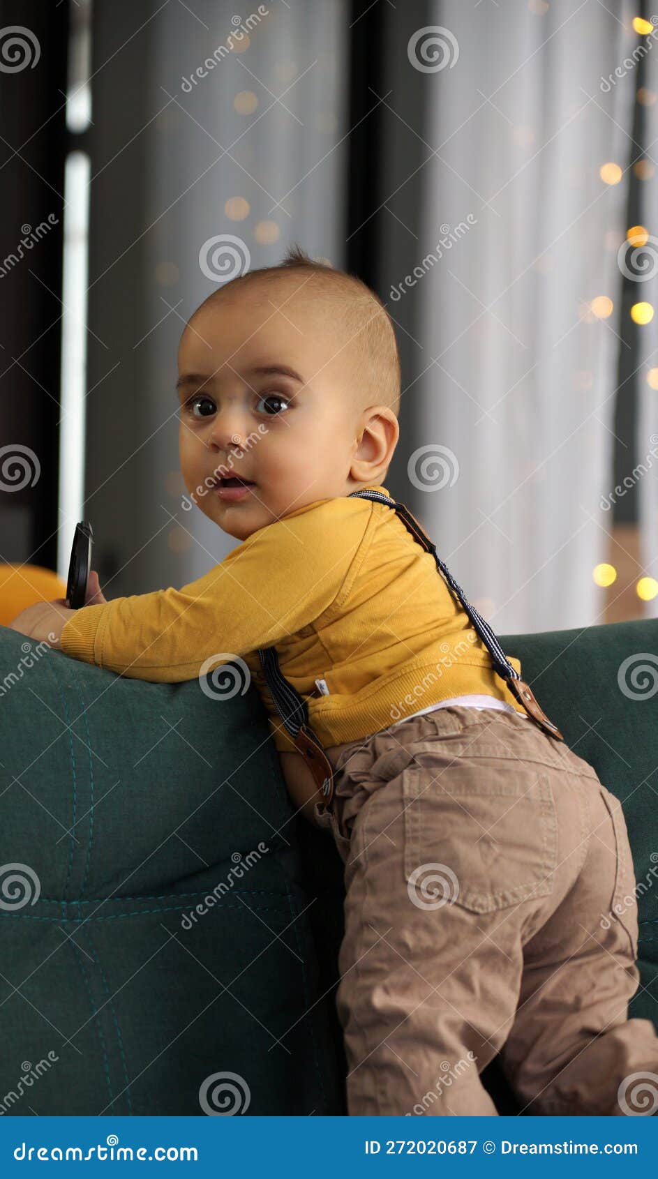 Adorable Kid Standing on Sofa and Looking Back Stock Image - Image of ...