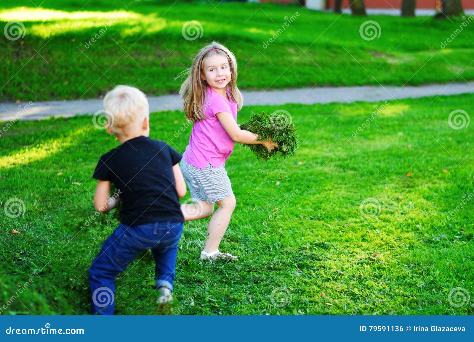 Adorable Kids Playing with Cutted Grass Stock Photo - Image of ...