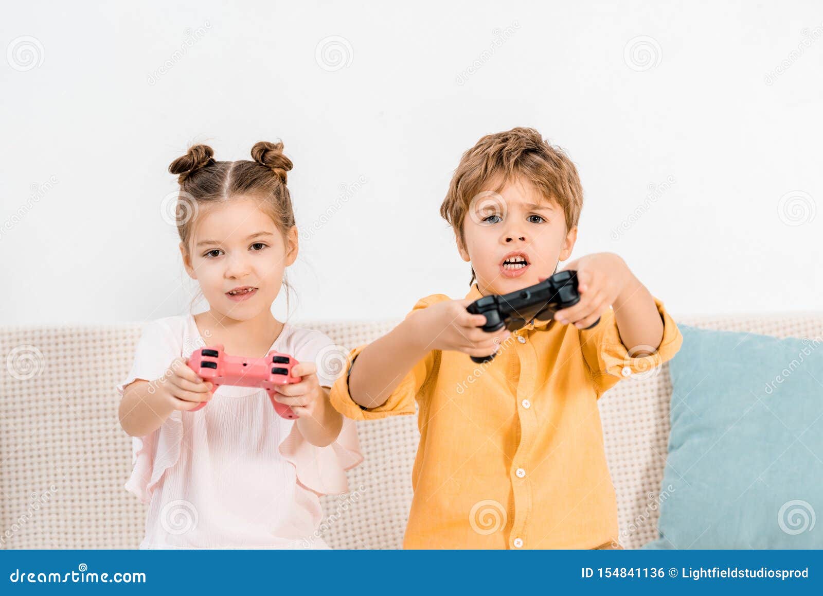 Adorable Kids Playing with Joysticks and Looking Stock Photo - Image of ...