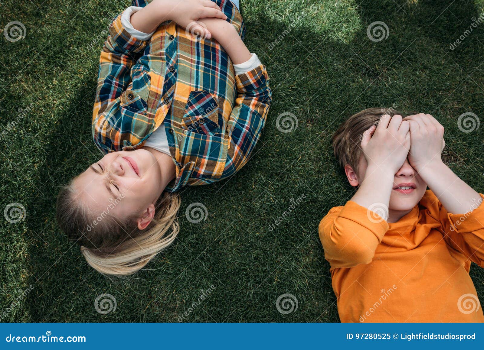 Adorable Kids Sunbathing while Lying on Grass Stock Image - Image of ...