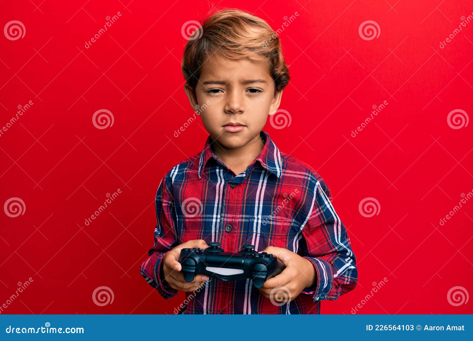 Adorable Latin Kid Playing Video Game Holding Controller Depressed and ...