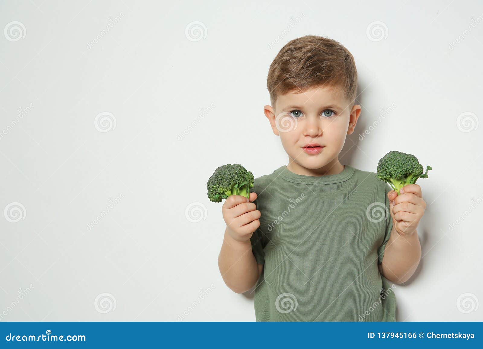 Adorable Little Boy with Broccoli on White Background. Stock Photo ...
