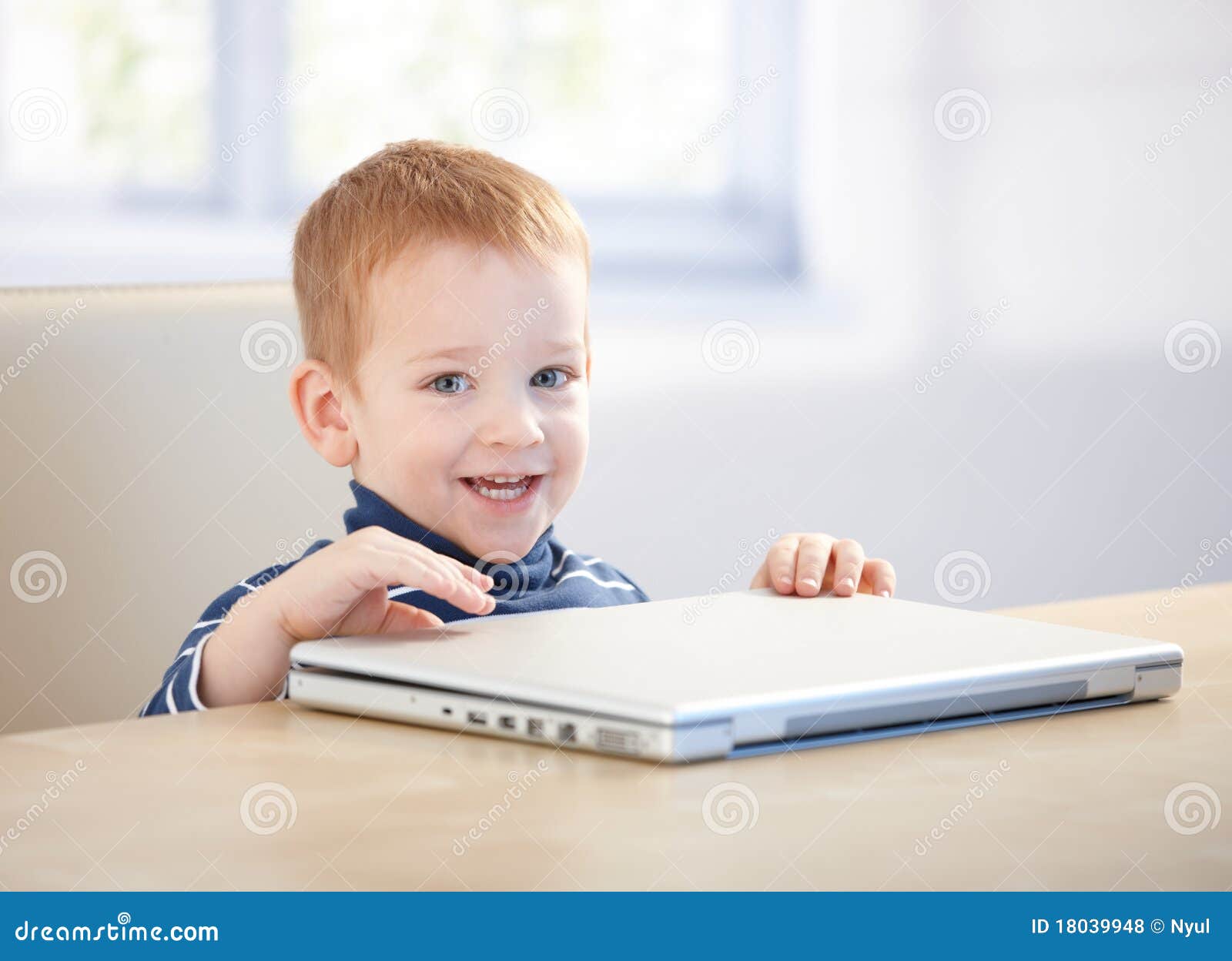 Adorable Little Boy Smiling with Laptop Stock Photo - Image of floor ...