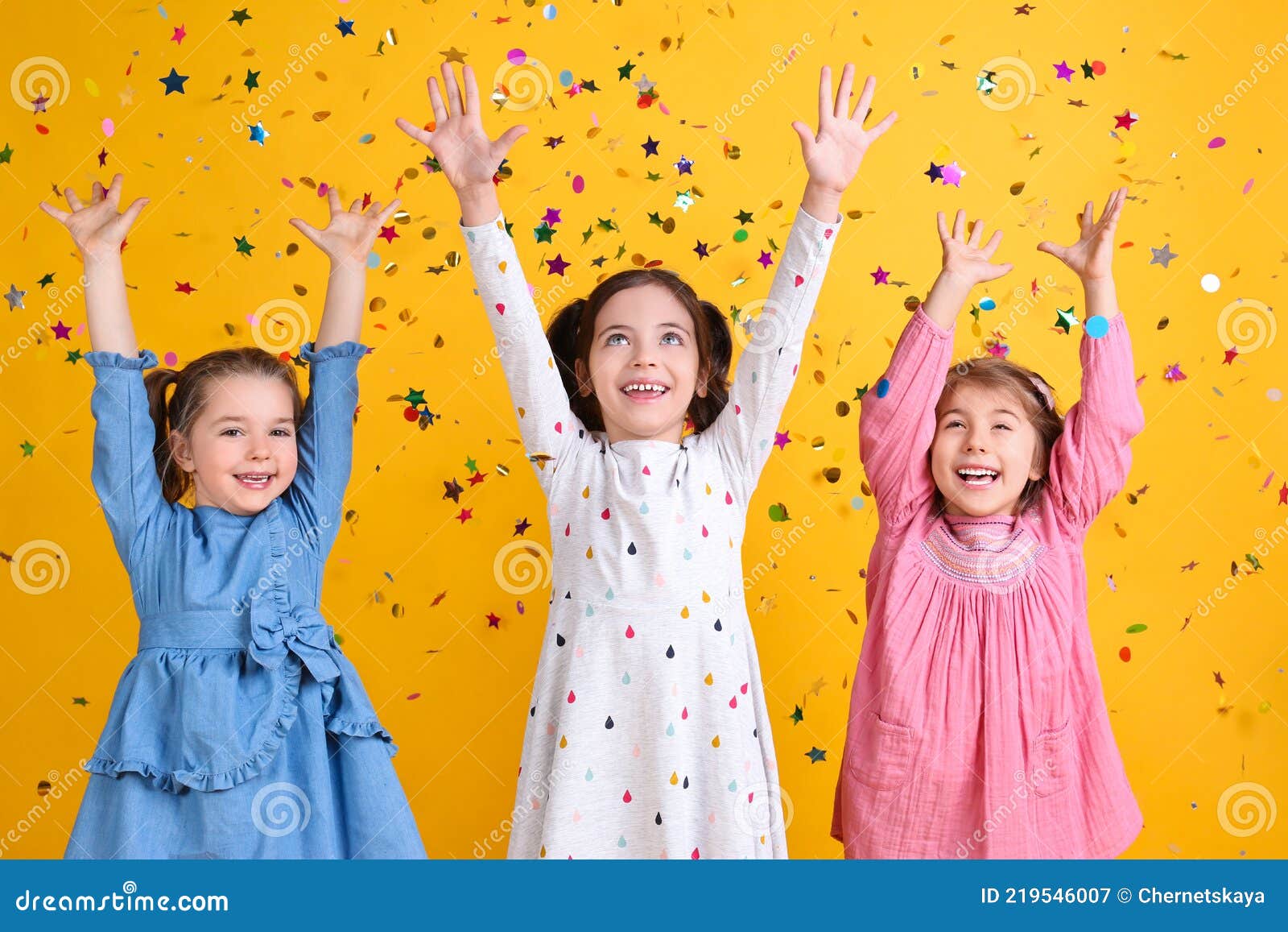 Adorable Little Children and Falling Confetti on Yellow Background ...