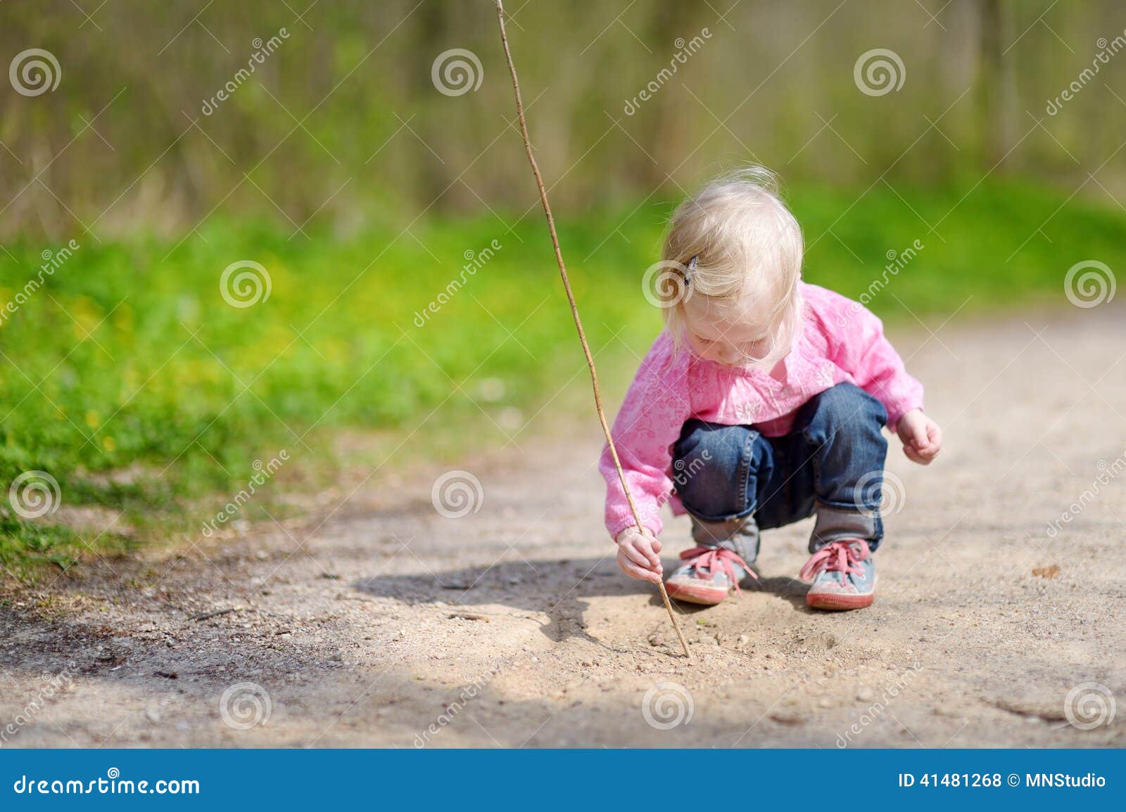 Adorable Little Girl Playing with a Stick Stock Photo - Image of forest ...
