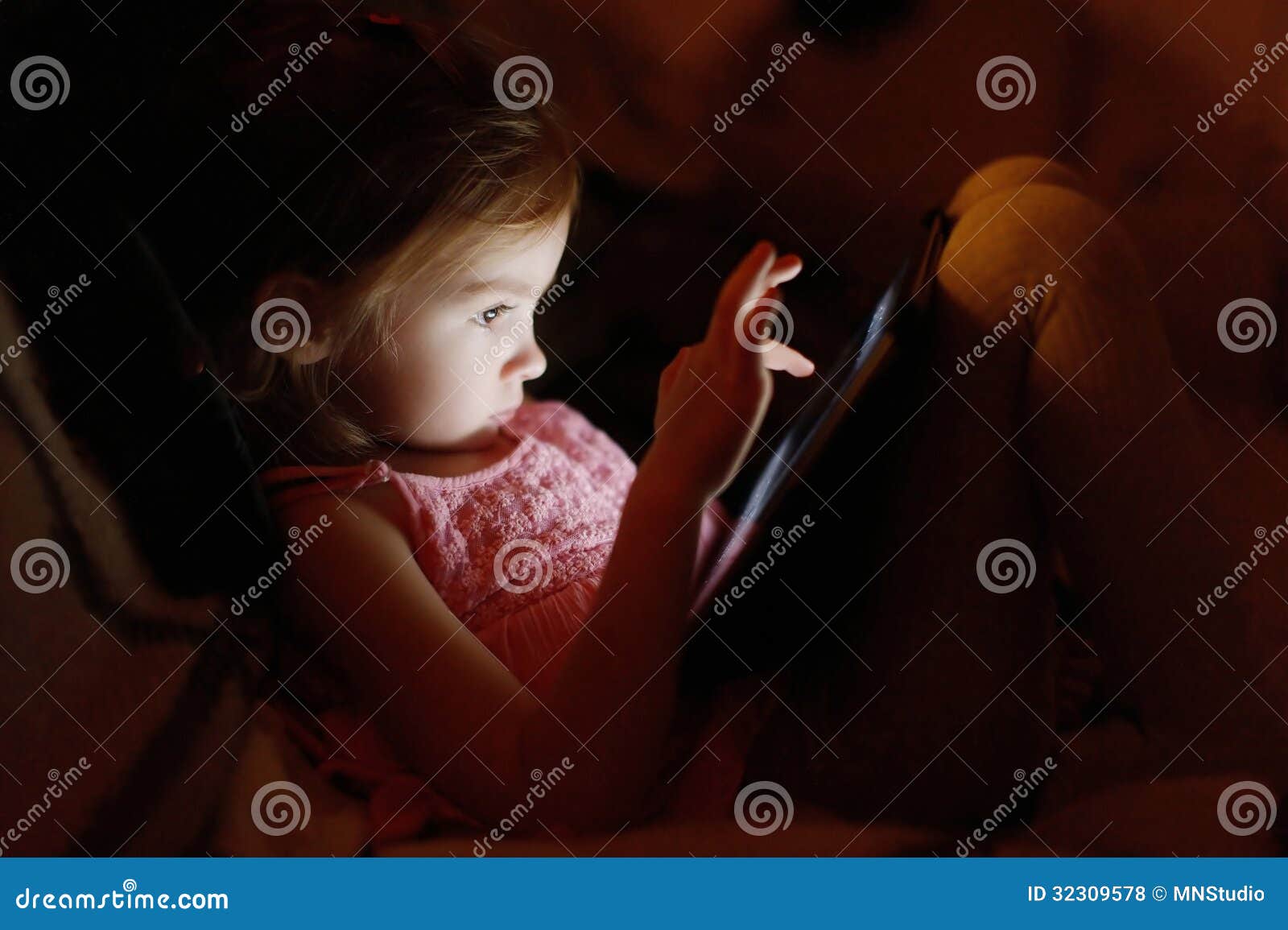 Adorable Little Girl Playing on a Tablet Stock Photo - Image of child ...