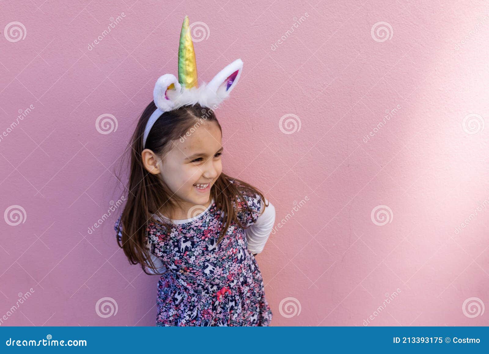 Adorable Little Girl Wearing a Unicorn Headband with Pink Background ... Adorable Little Girl Wearing a Unicorn Headband with Pink Background ...