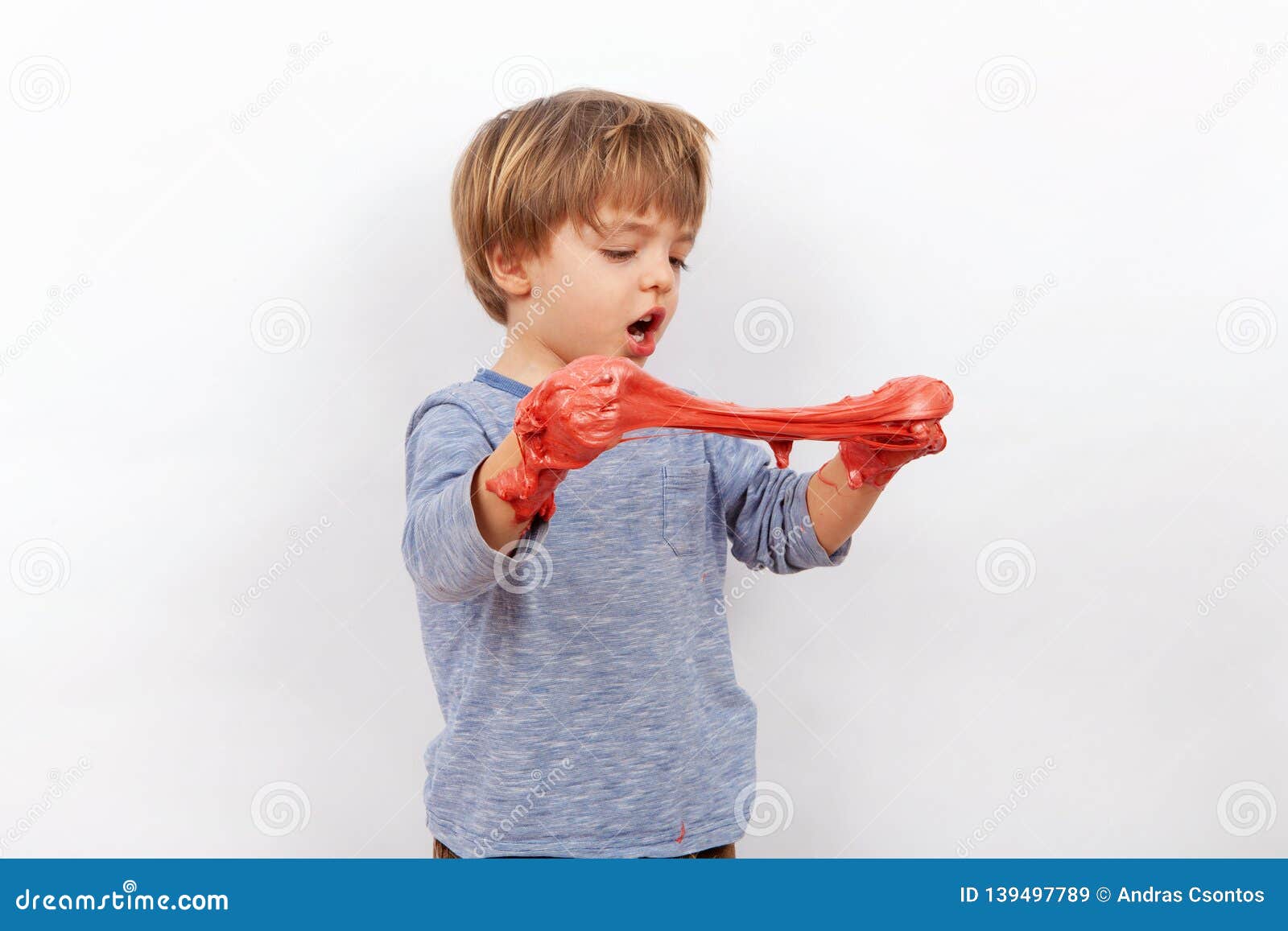 Adorable Preschooler Boy Playing with a Red Slime Stock Image - Image ...