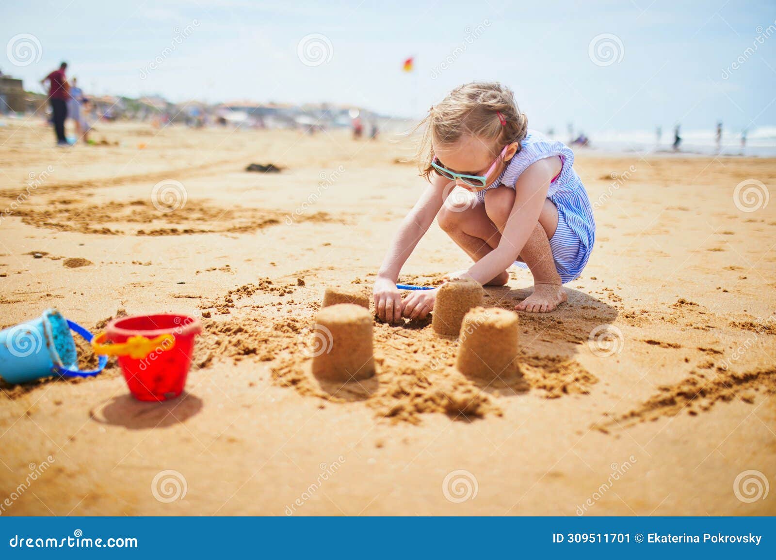 Adorable Preschooler Girl Playing On The Sand Beach At Atlantic Coast