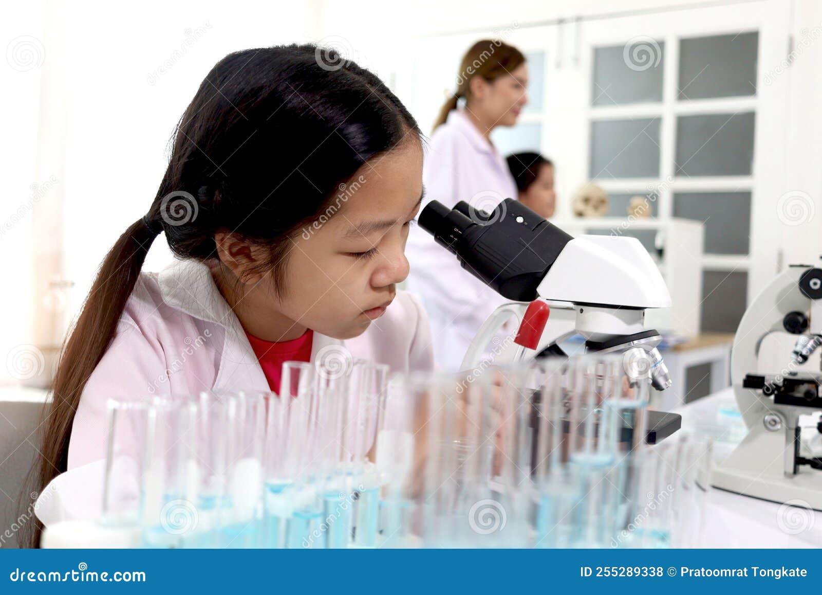 Adorable Schoolgirl in Lab Coat Doing Science Experiments, Young Scientist Looking through ...
