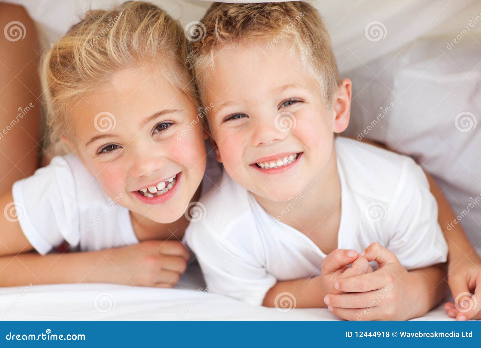 Adorable Siblings Playing on a Bed Stock Photo - Image of daughter ...