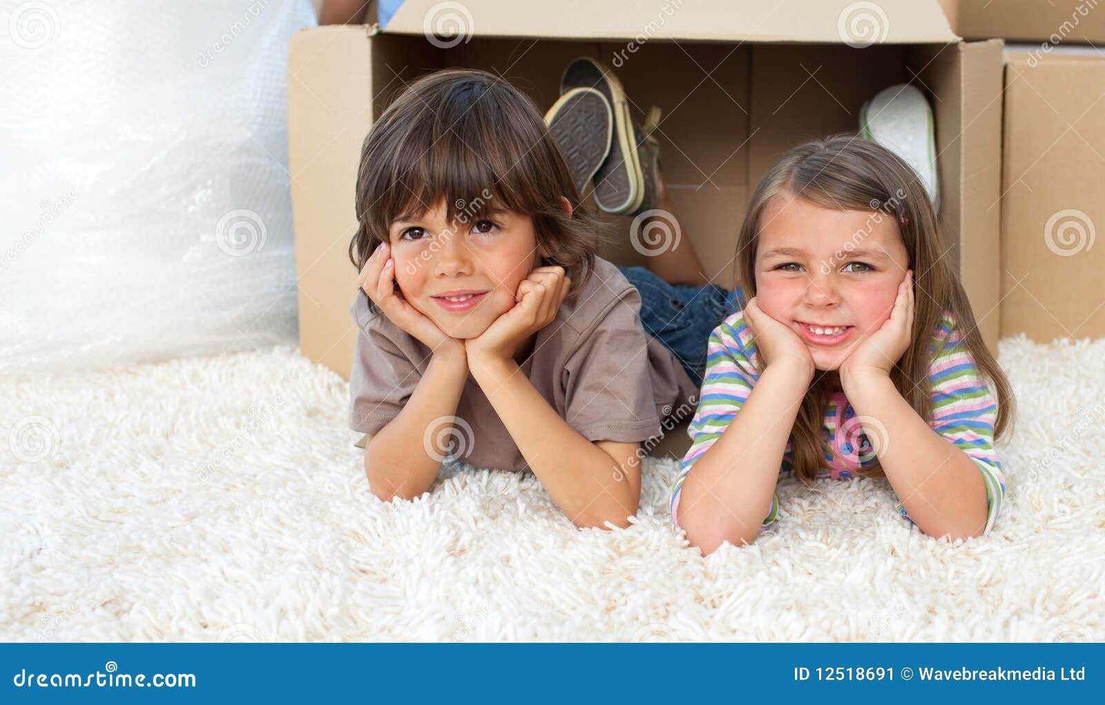 Adorable Siblings Playing with Boxes Stock Image - Image of property ...