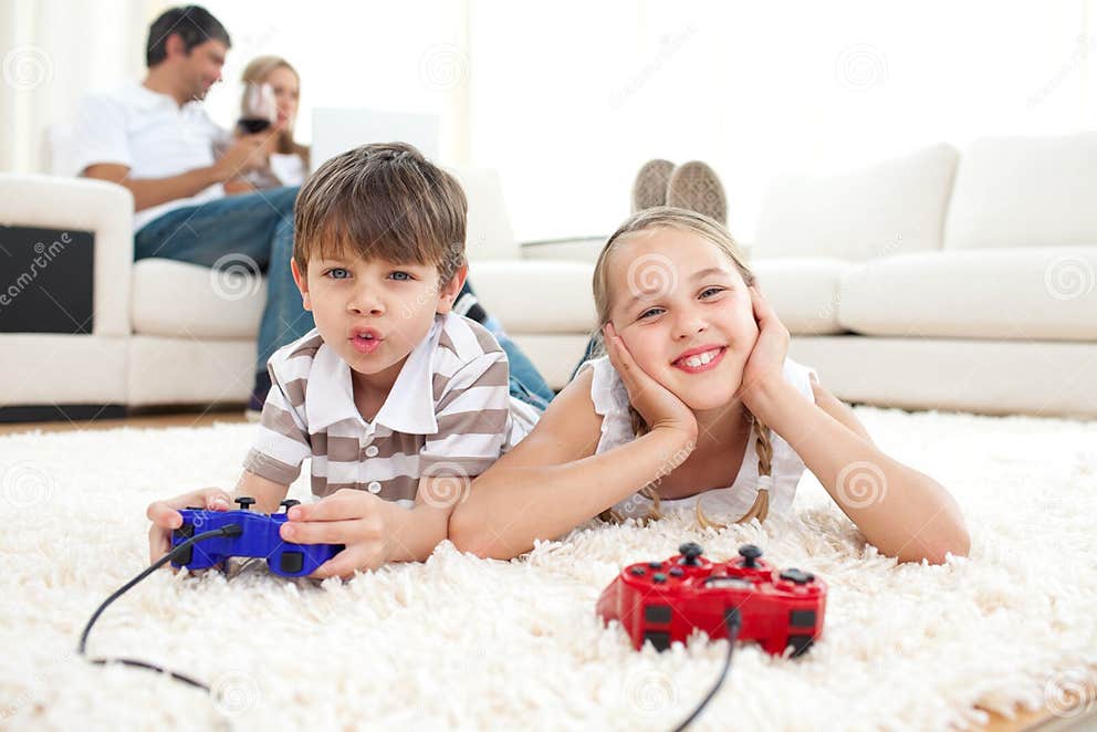 Adorable Siblings Playing Video Games Stock Photo - Image of father ...