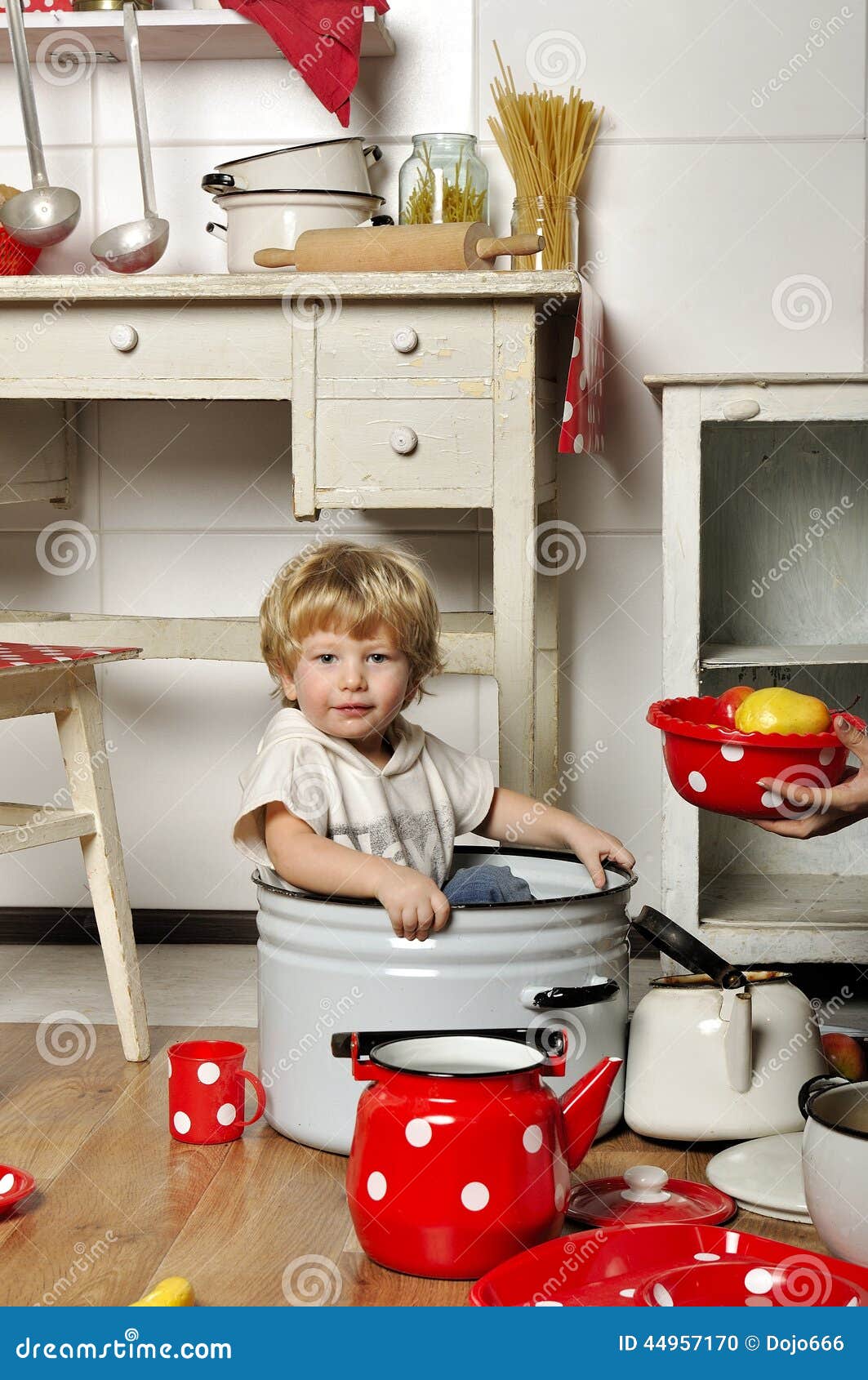 Adorable Small Child Sits in Kitchen Inside a Pan Stock Photo - Image ...