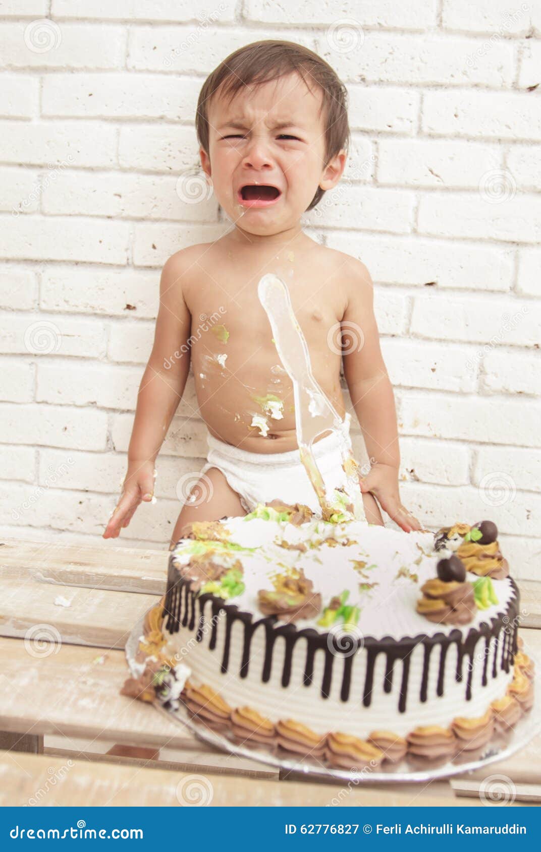 Adorable Toddler Crying while Playing Smash Cake Stock Image - Image of ...