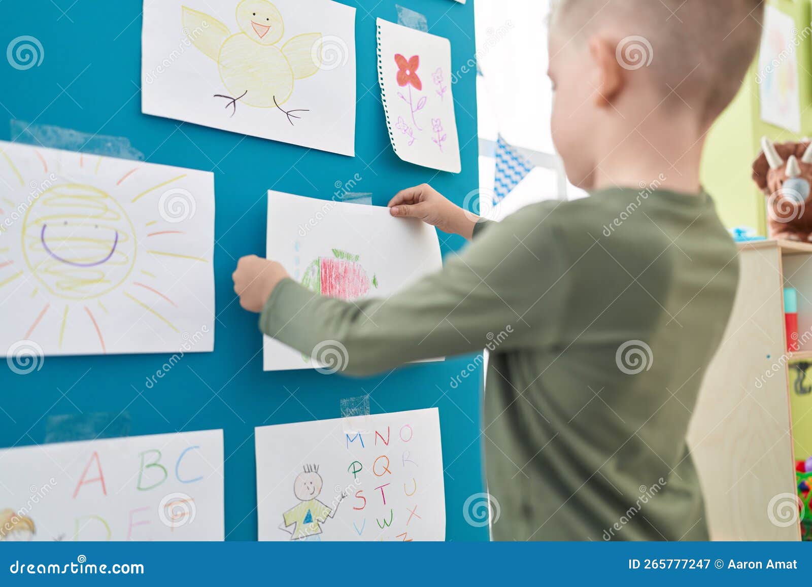 Adorable Toddler Hanging Draw on Wall at Classroom Stock Image - Image ...