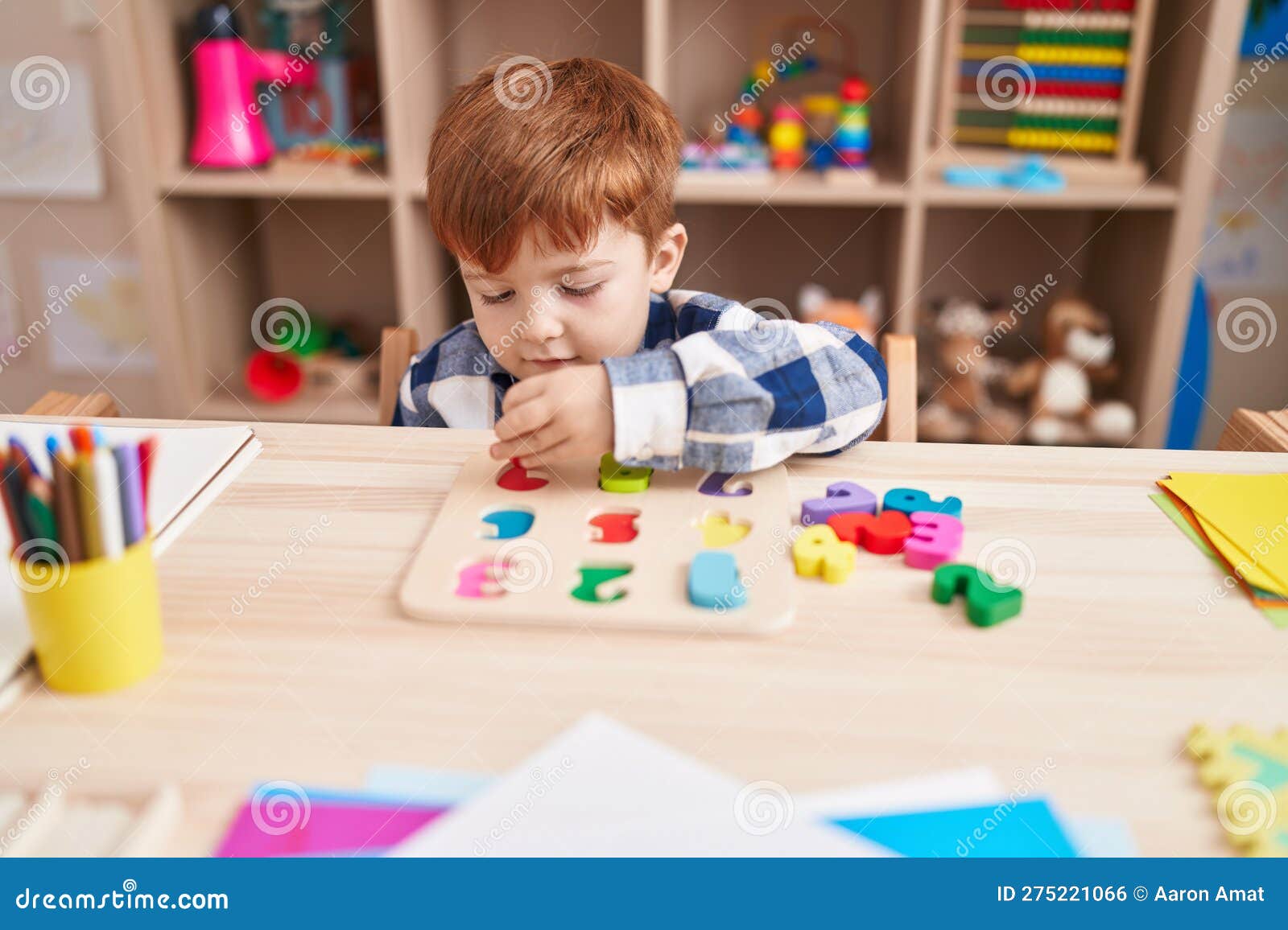 Adorable Toddler Playing with Maths Puzzle Game Sitting on Table at ...