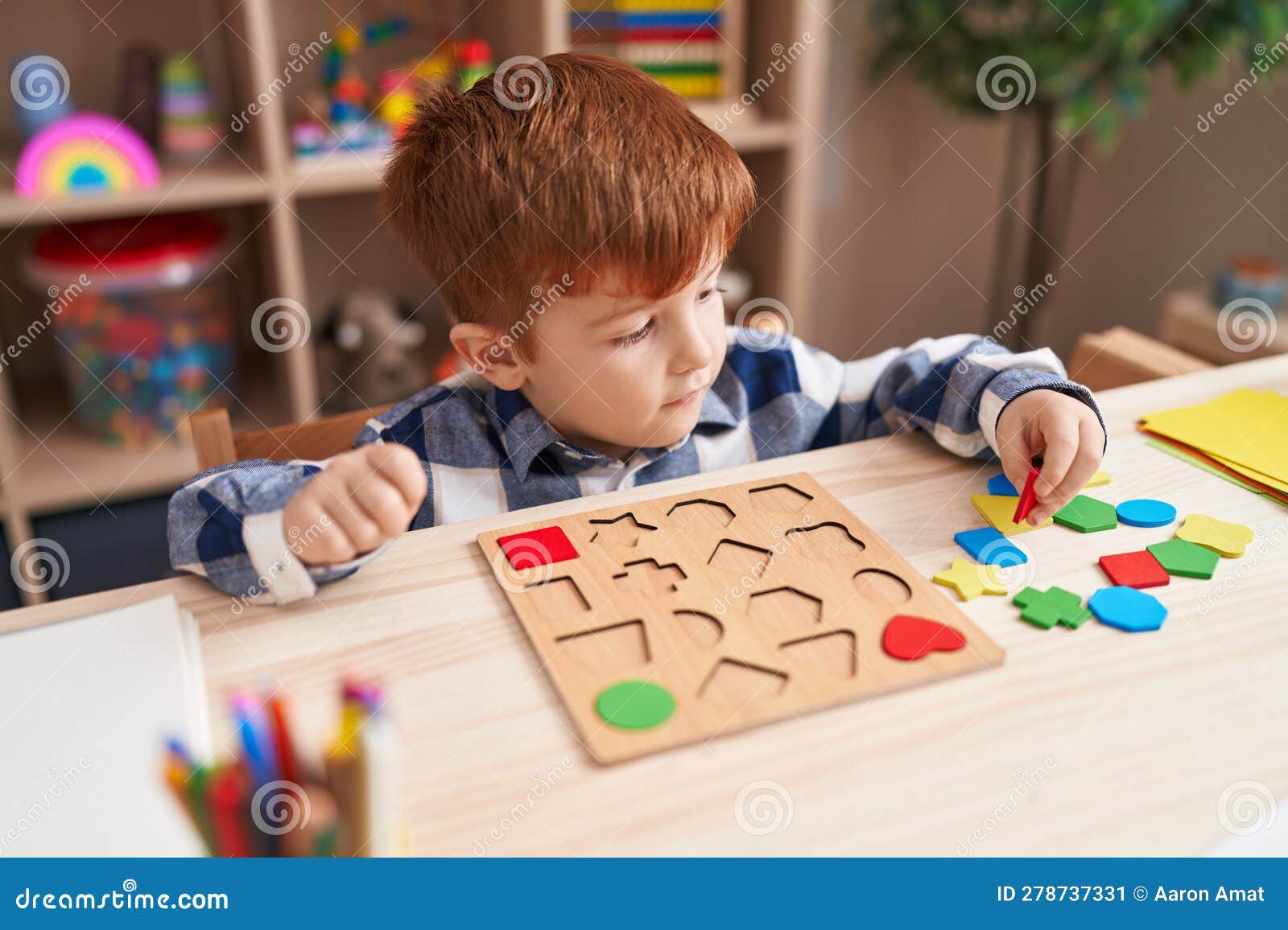 Adorable Toddler Playing with Maths Puzzle Game Sitting on Table at ...