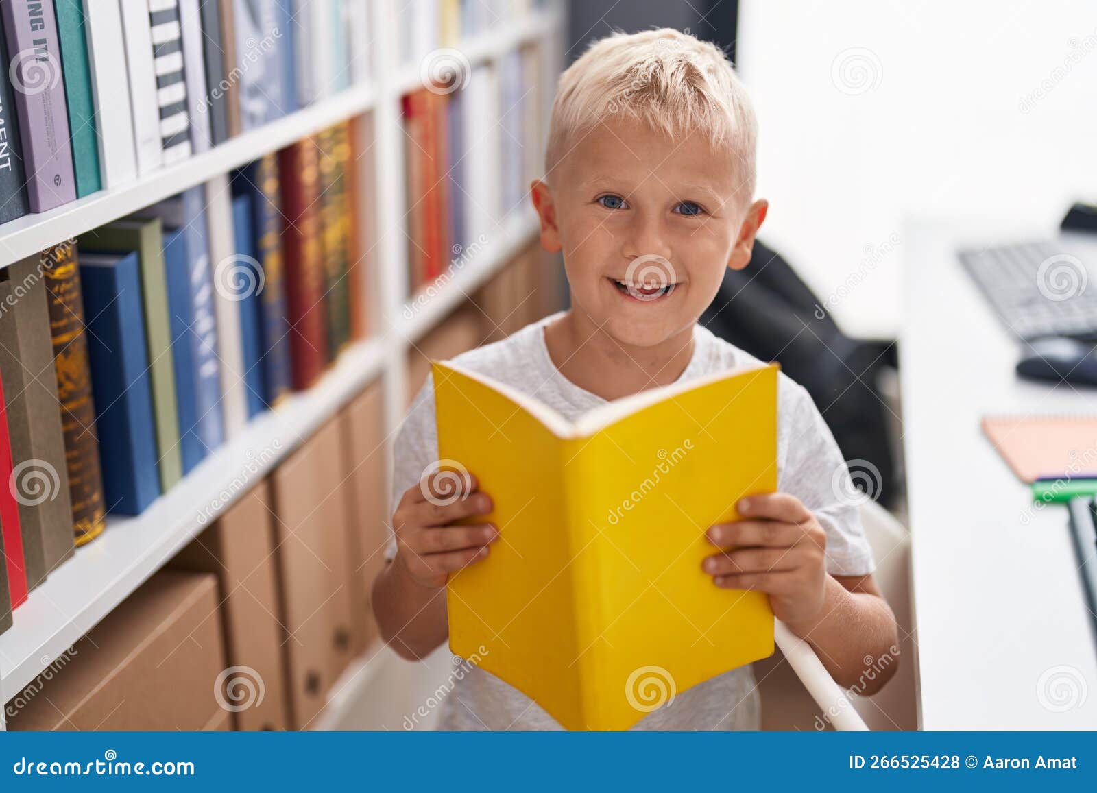 Adorable Toddler Reading Book Standing at Classroom Stock Photo - Image ...