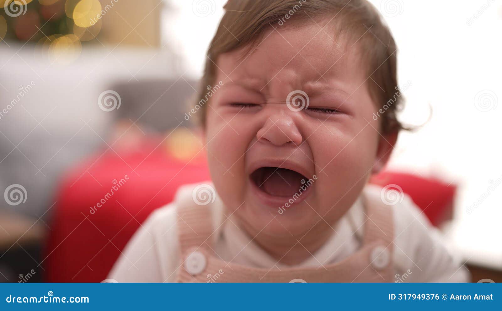 Adorable Toddler Sitting on Floor Crying at Home Stock Photo - Image of ...