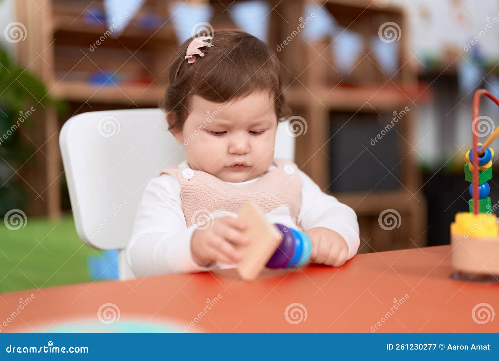Adorable Toddler Sitting on Table Playing at Kindergarten Stock Image ...