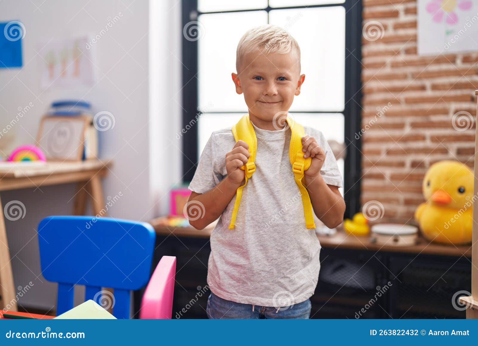 Adorable Toddler Smiling Confident Wearing Backpack at Classroom Stock ...