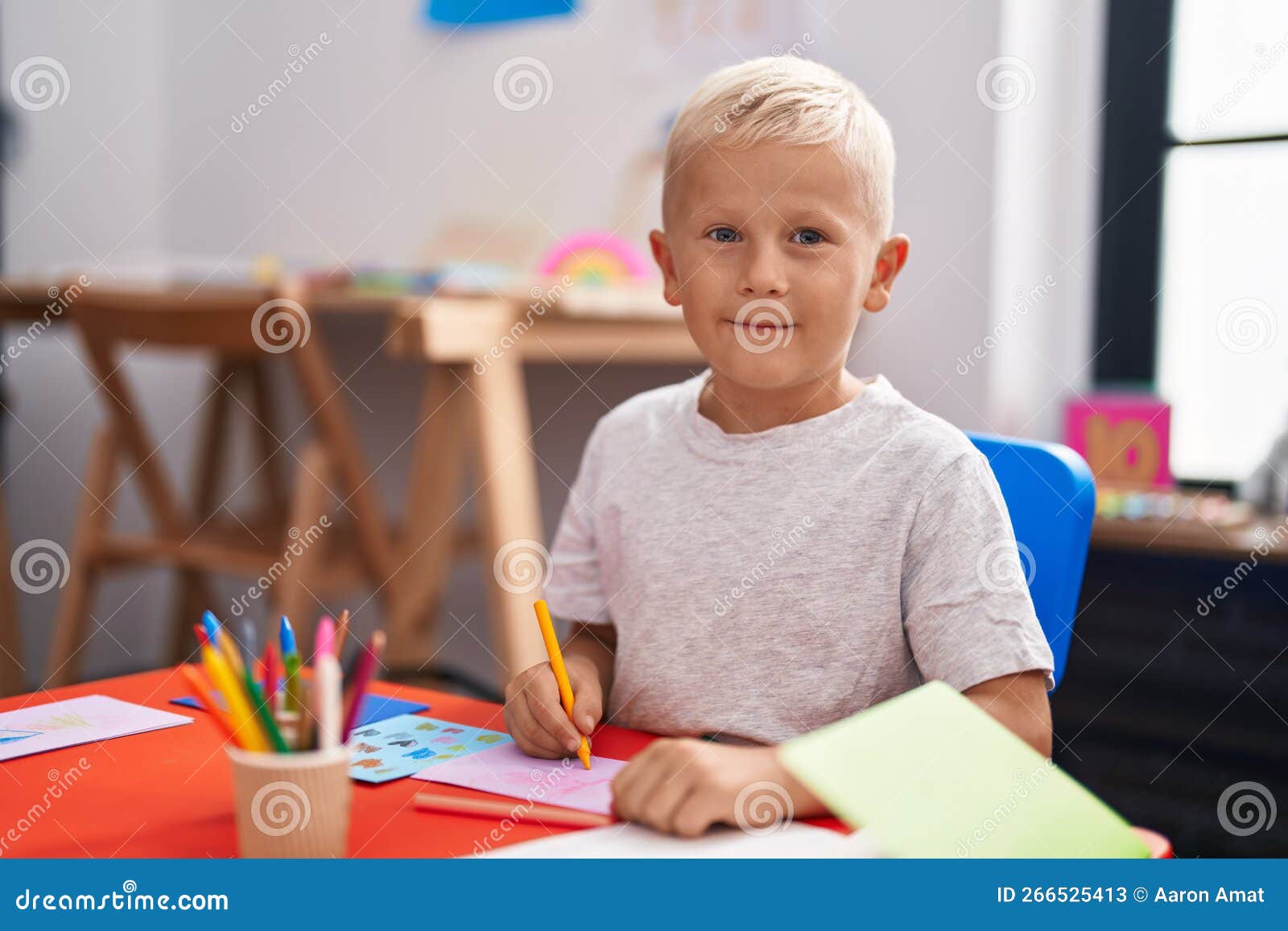 Adorable Toddler Student Drawing on Notebook Sitting on Table at ...