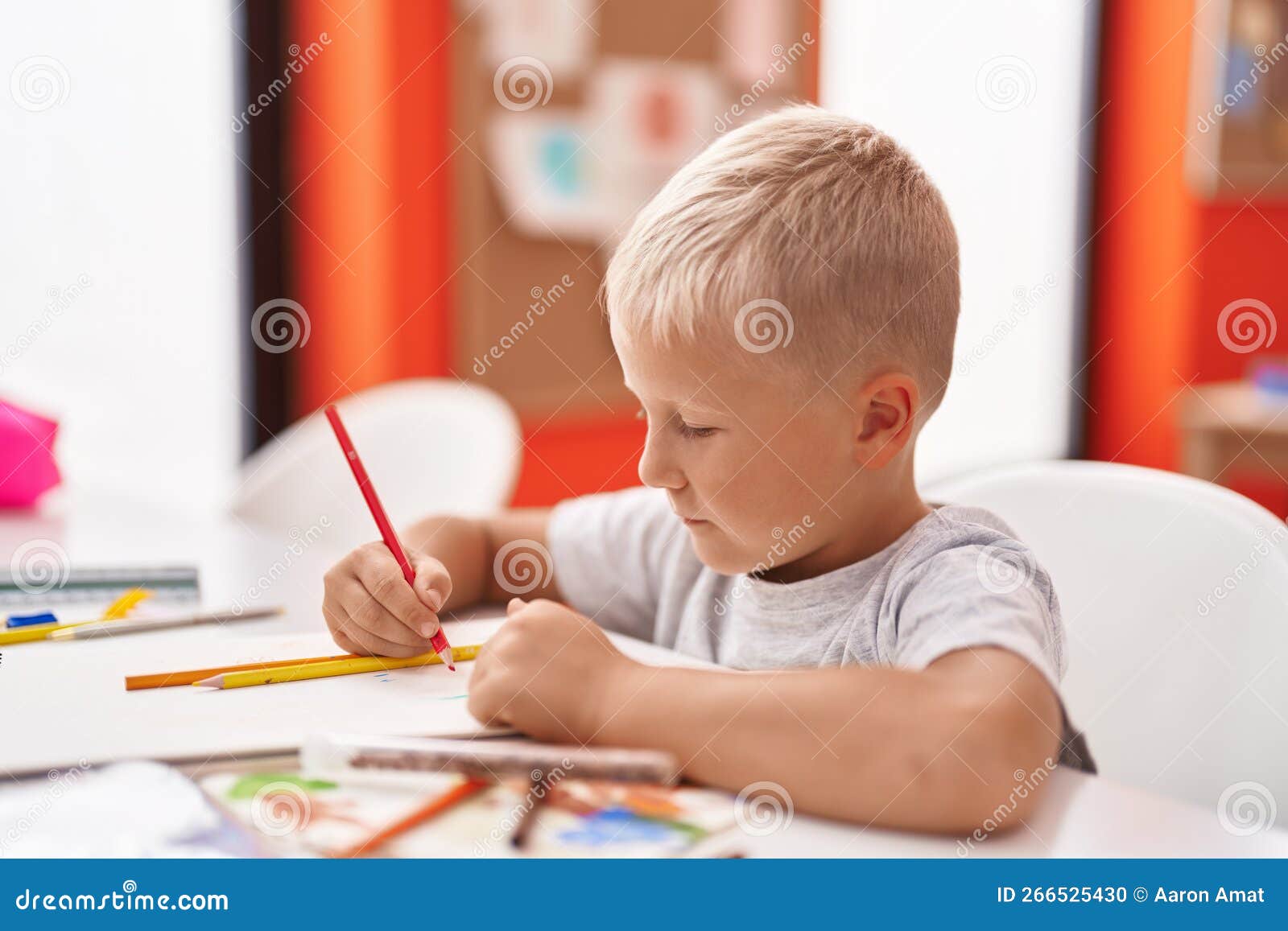 Adorable Toddler Student Drawing on Notebook Sitting on Table at ...