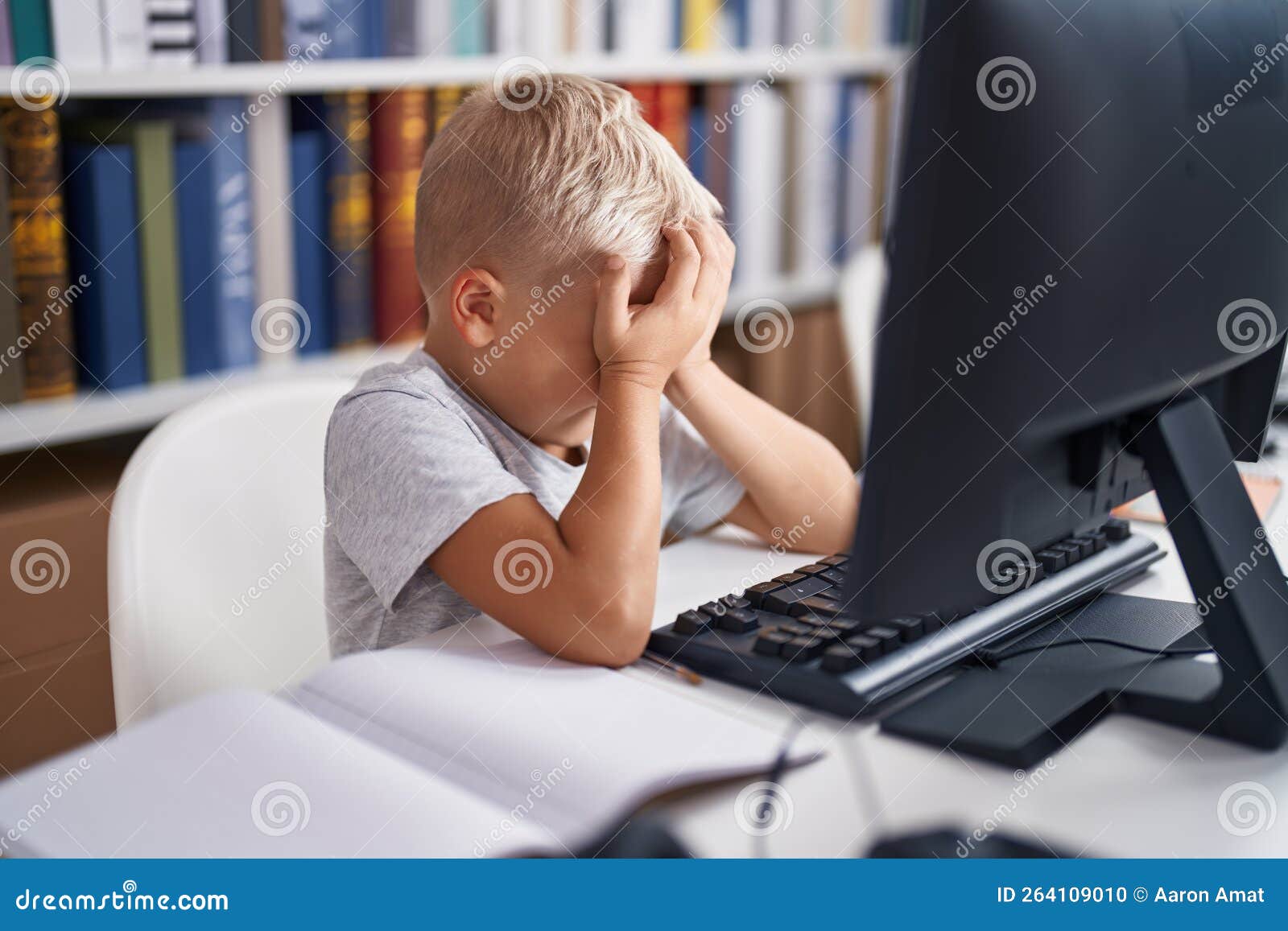 Adorable Toddler Student Stressed Using Computer Sitting on Table at ...