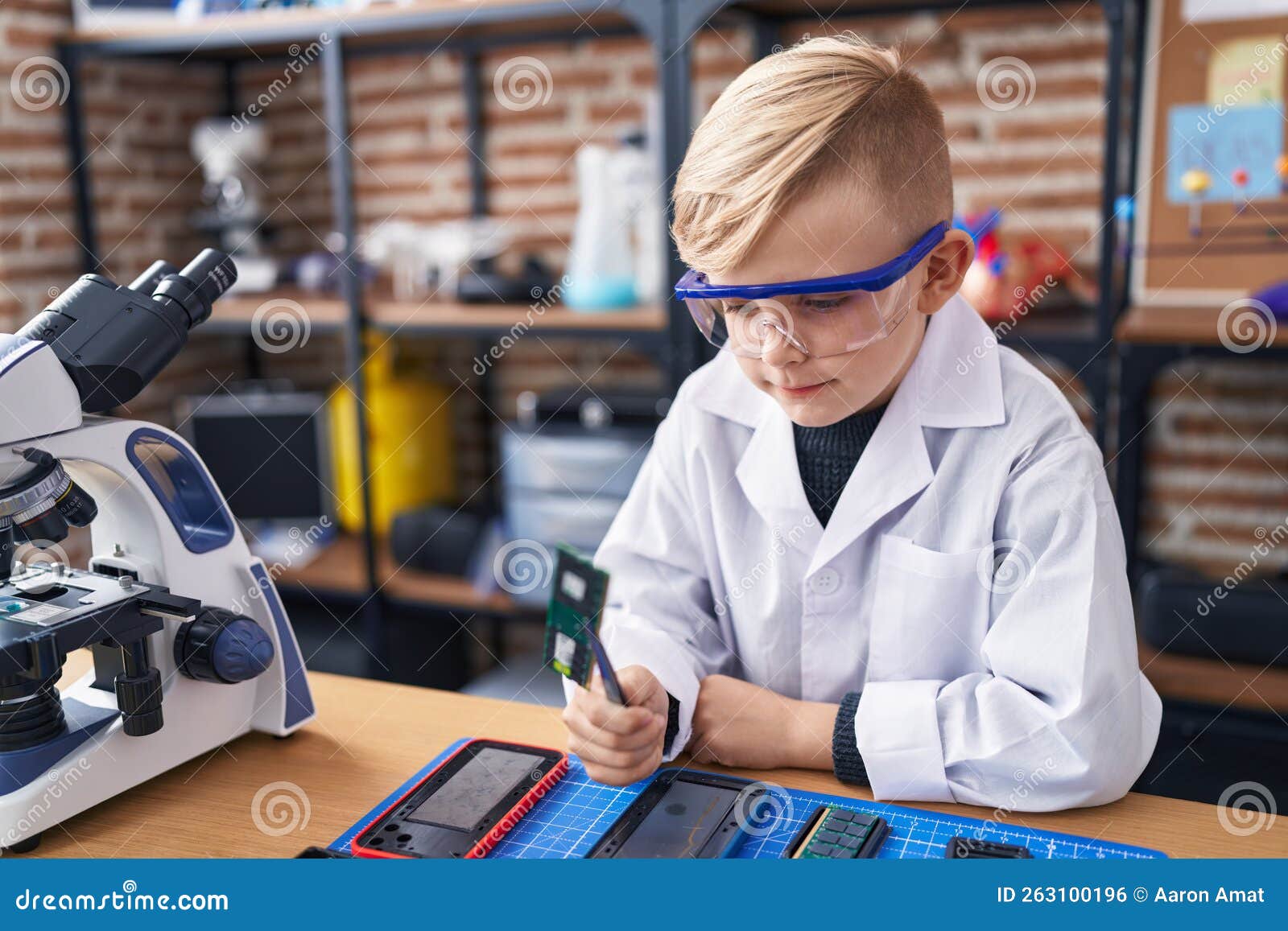Adorable Toddler Technician Repairing Smartphone at Classroom Stock ...