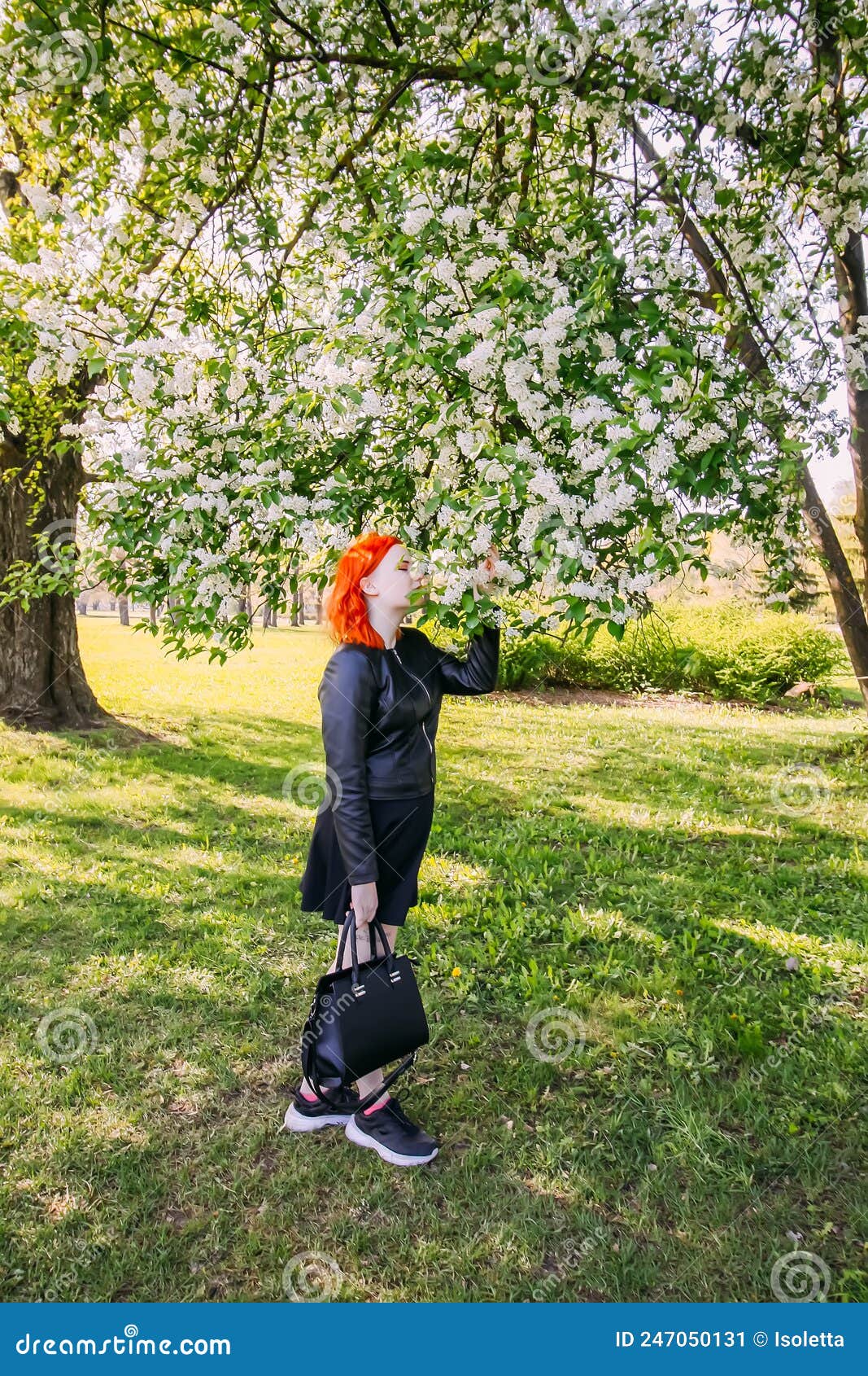 Adorable Young Girl Having Fun in a Spring Park with Flowering Trees ...