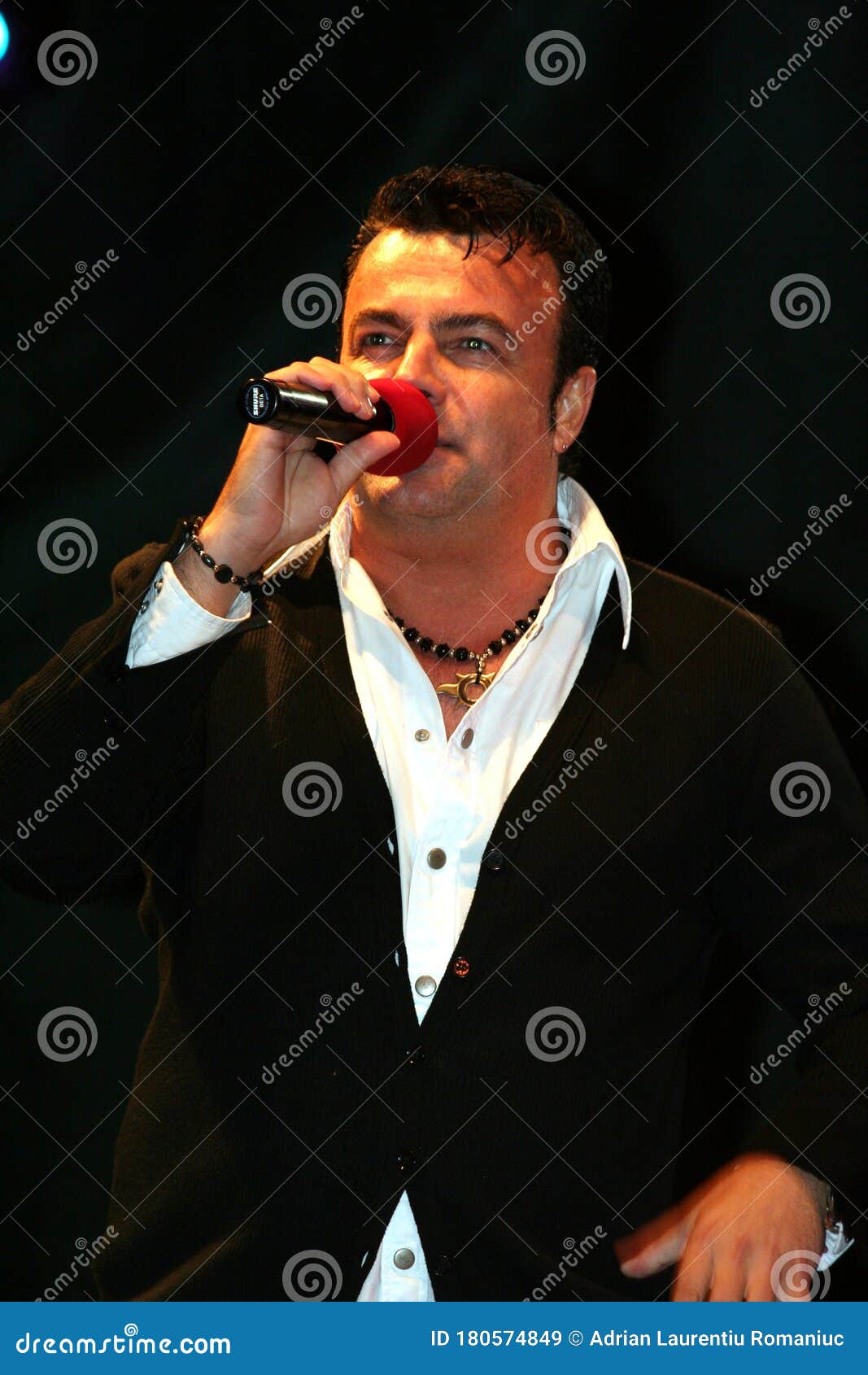 Adrian Enache Singing on a Stage in Front of the Spectators. Editorial ...