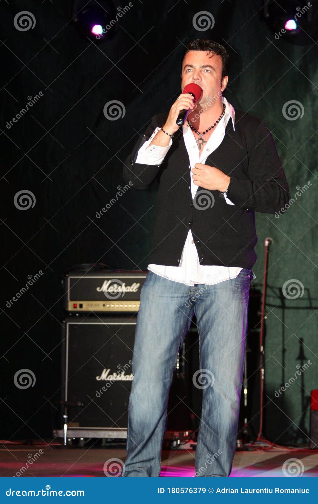 Adrian Enache Singing on a Stage in Front of the Spectators. Editorial ...