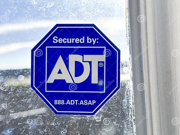 An ADT Security Sign on a Window Editorial Photo - Image of password ...