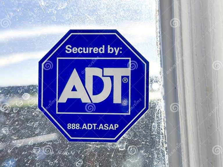 An ADT Security Sign on a Window Editorial Photo - Image of password ...