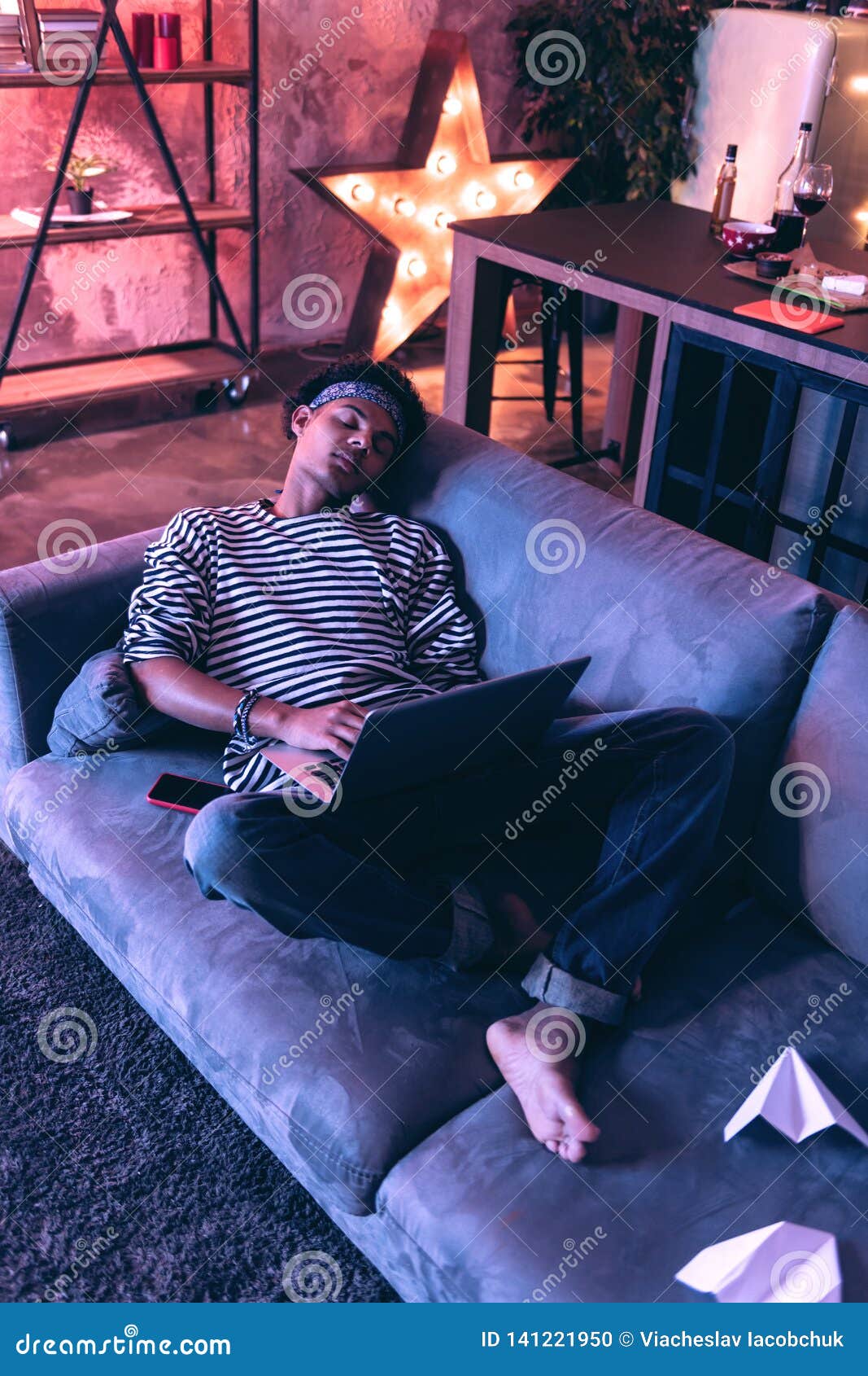 Adult Boy Falling Asleep on a Couch while Doing Boring Homework. Stock ...