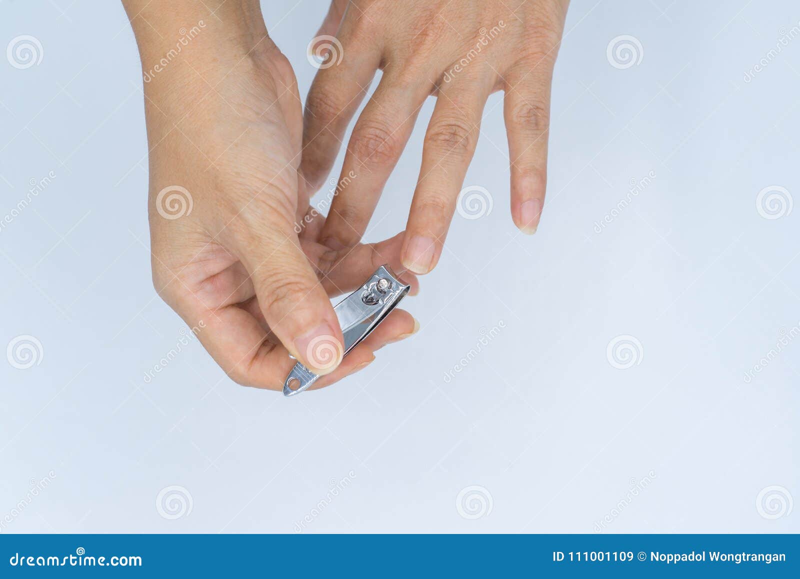 Adult Female Hands Holding Nail Clipper Cutting Fingernail Stock Image
