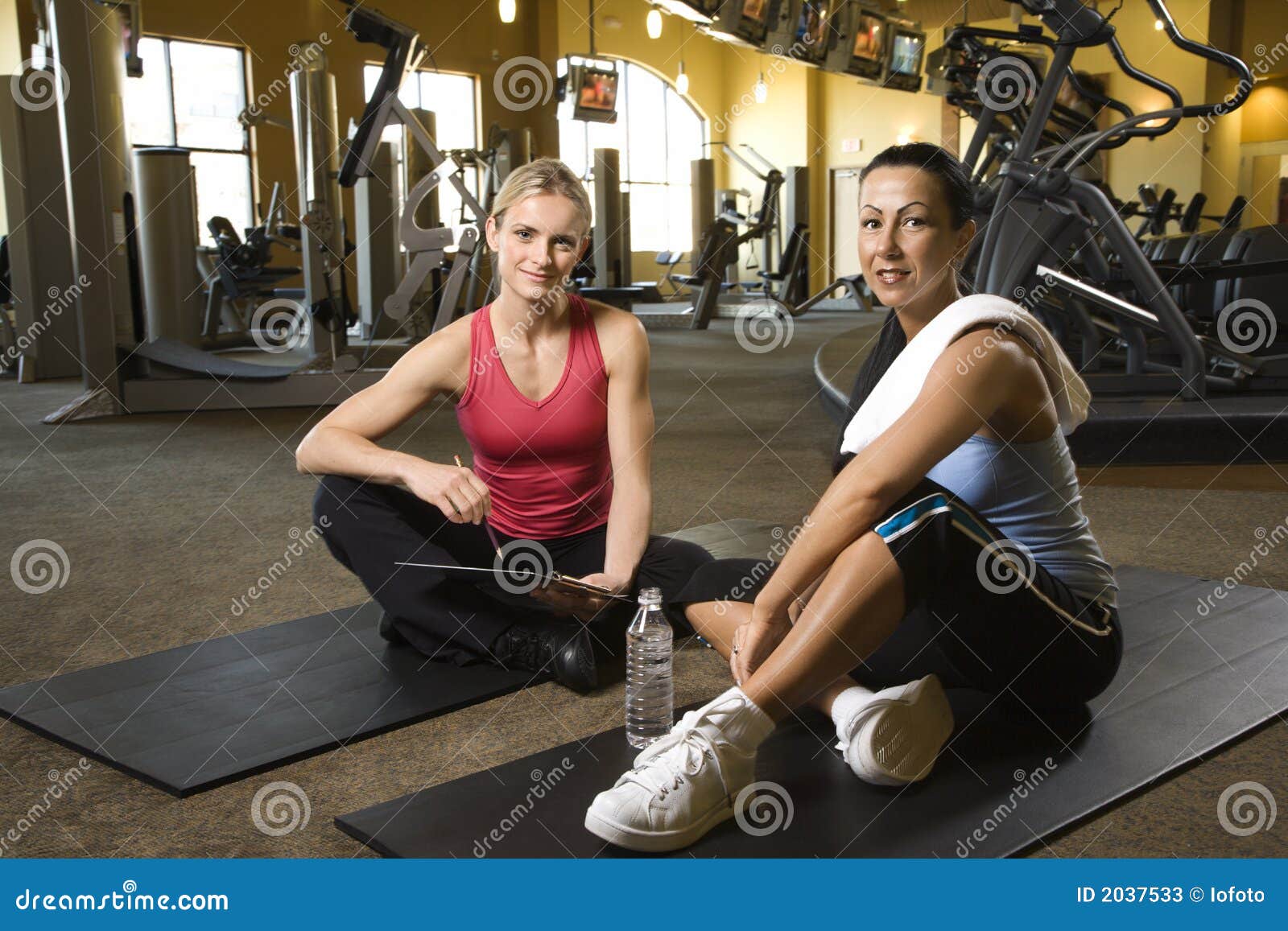 Adult Female With Personal Trainer At Gym Stock Image Image Of