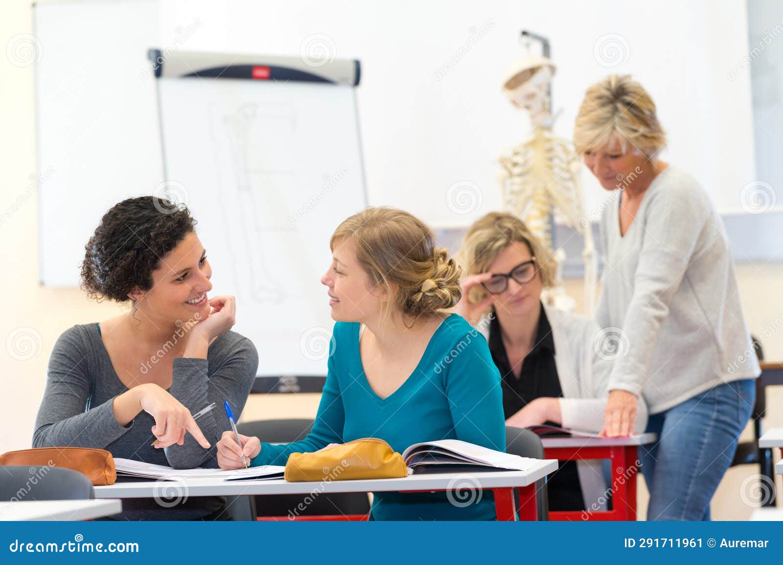 Adult Female Students Socializing while in Class Stock Image - Image of ...