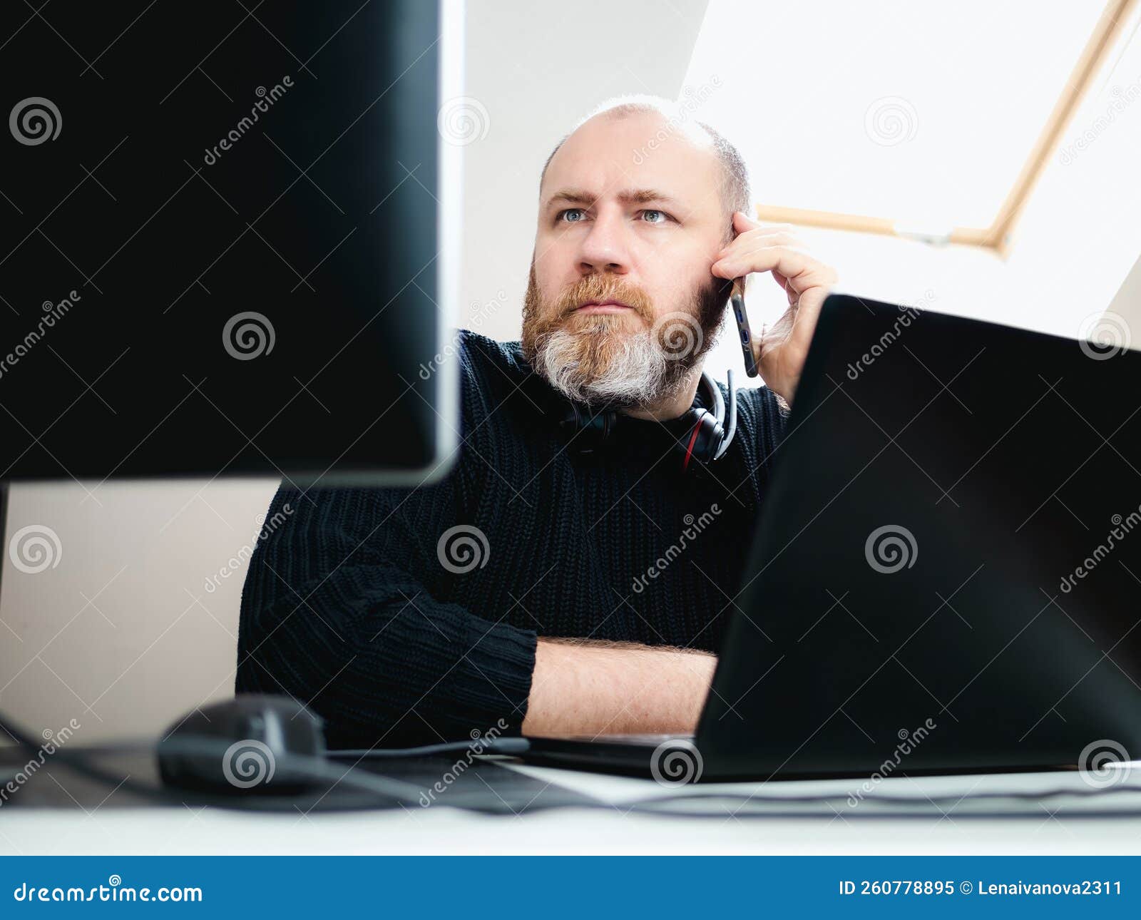 Adult Focused Man Calling by Smartphone during Remote Work on Laptop ...