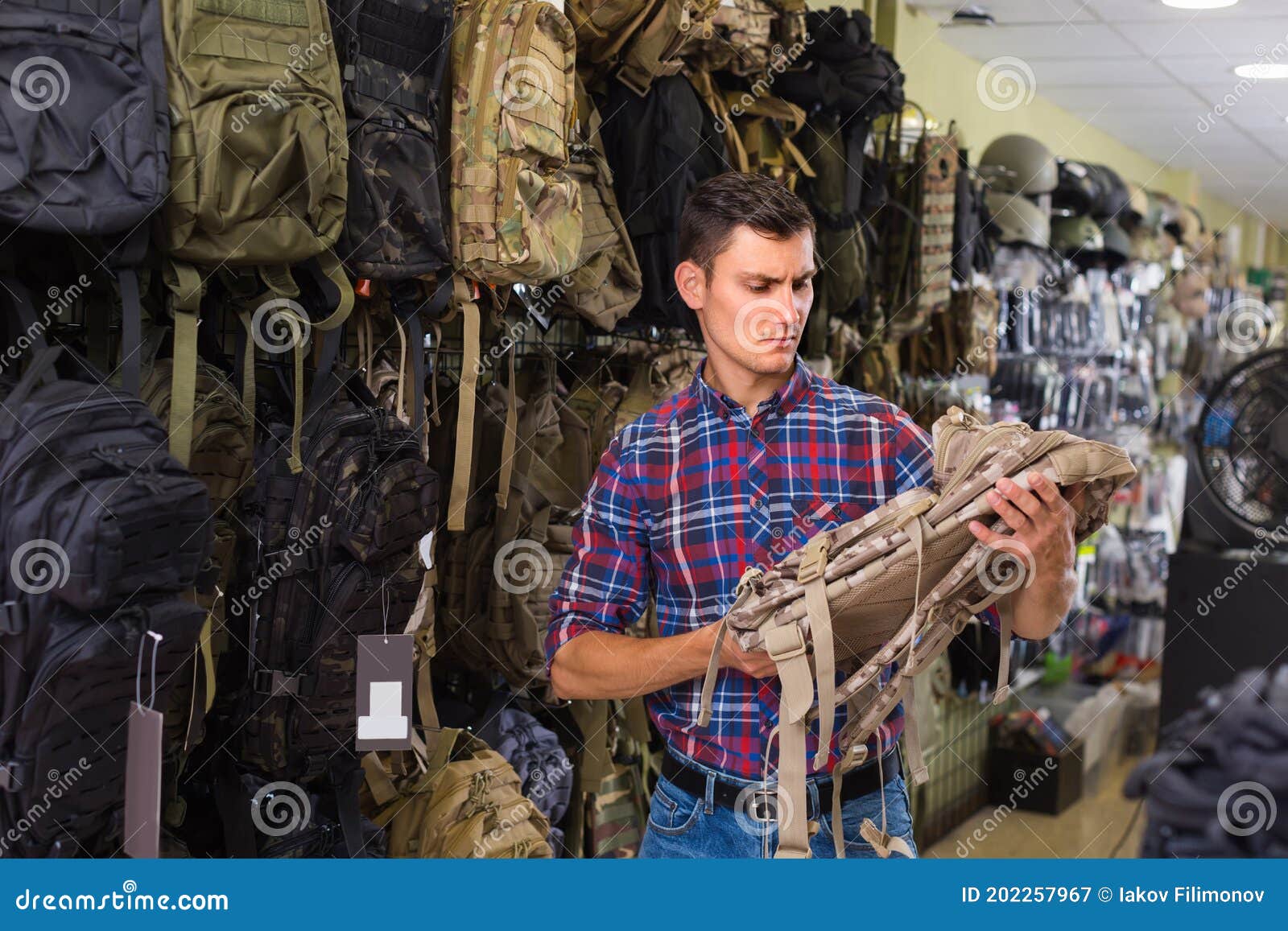 Guy Looking Camouflage Backpack in Army Store Stock Image - Image of ...
