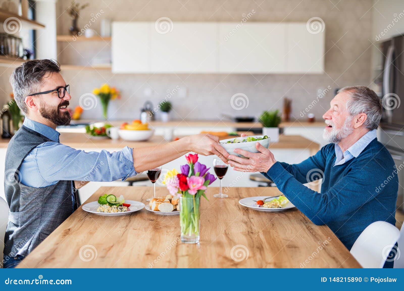 Adult Hipster Son And Senior Father Indoors At Home Having Lunch