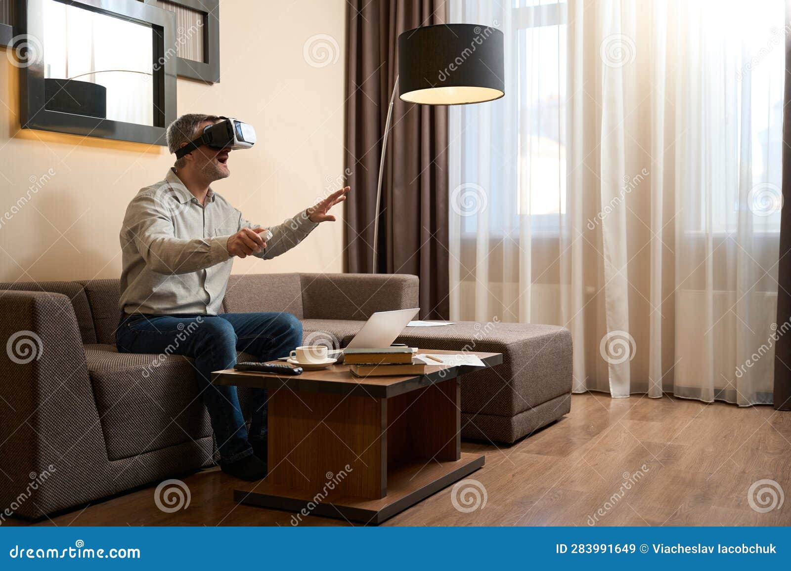 Adult Male Using Virtual Reality Headset Sitting on Couch Stock Image ...