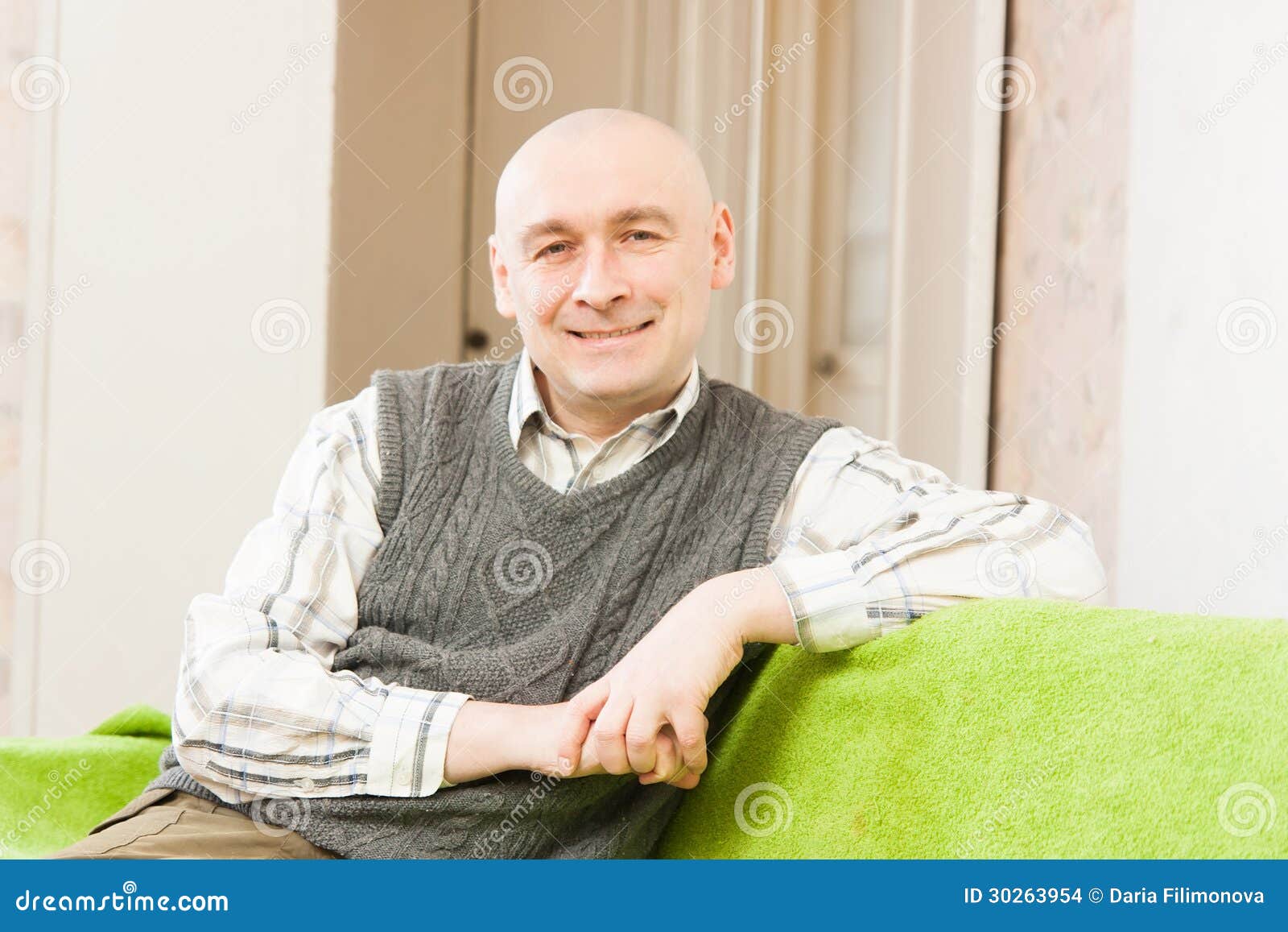 Man sitting on the sofa stock photo. Image of portrait - 30263954