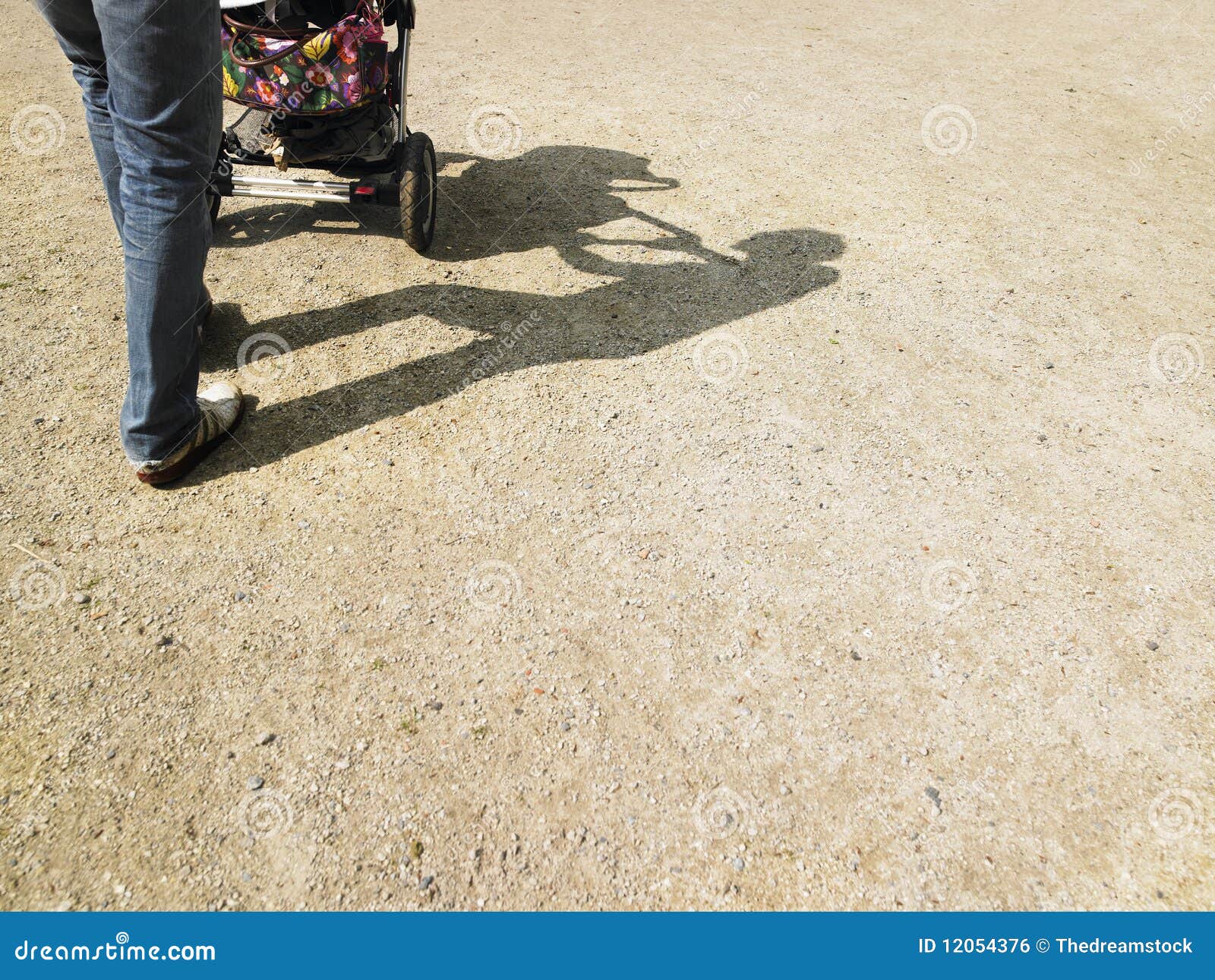 Adult Pushing Stroller stock photo. Image of outdoors - 12054376