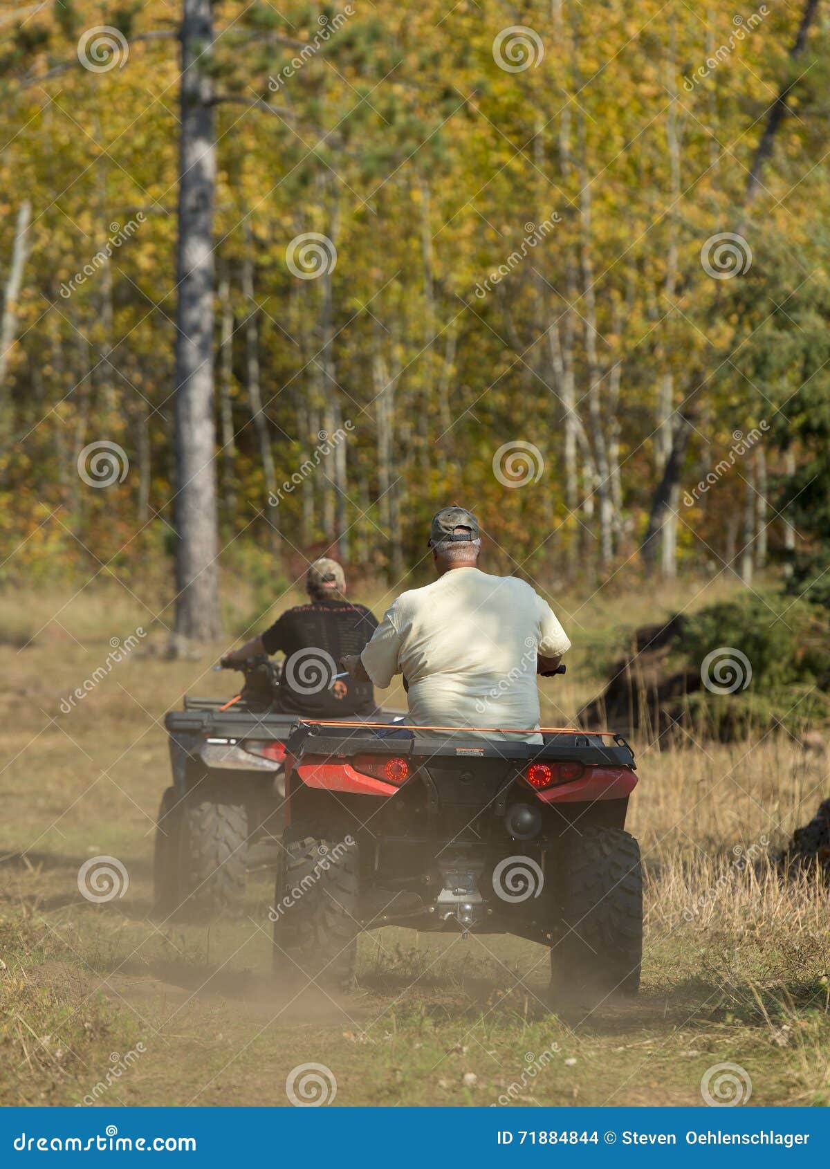 An Adult riding an ATV stock photo. Image of road, trail - 71884844